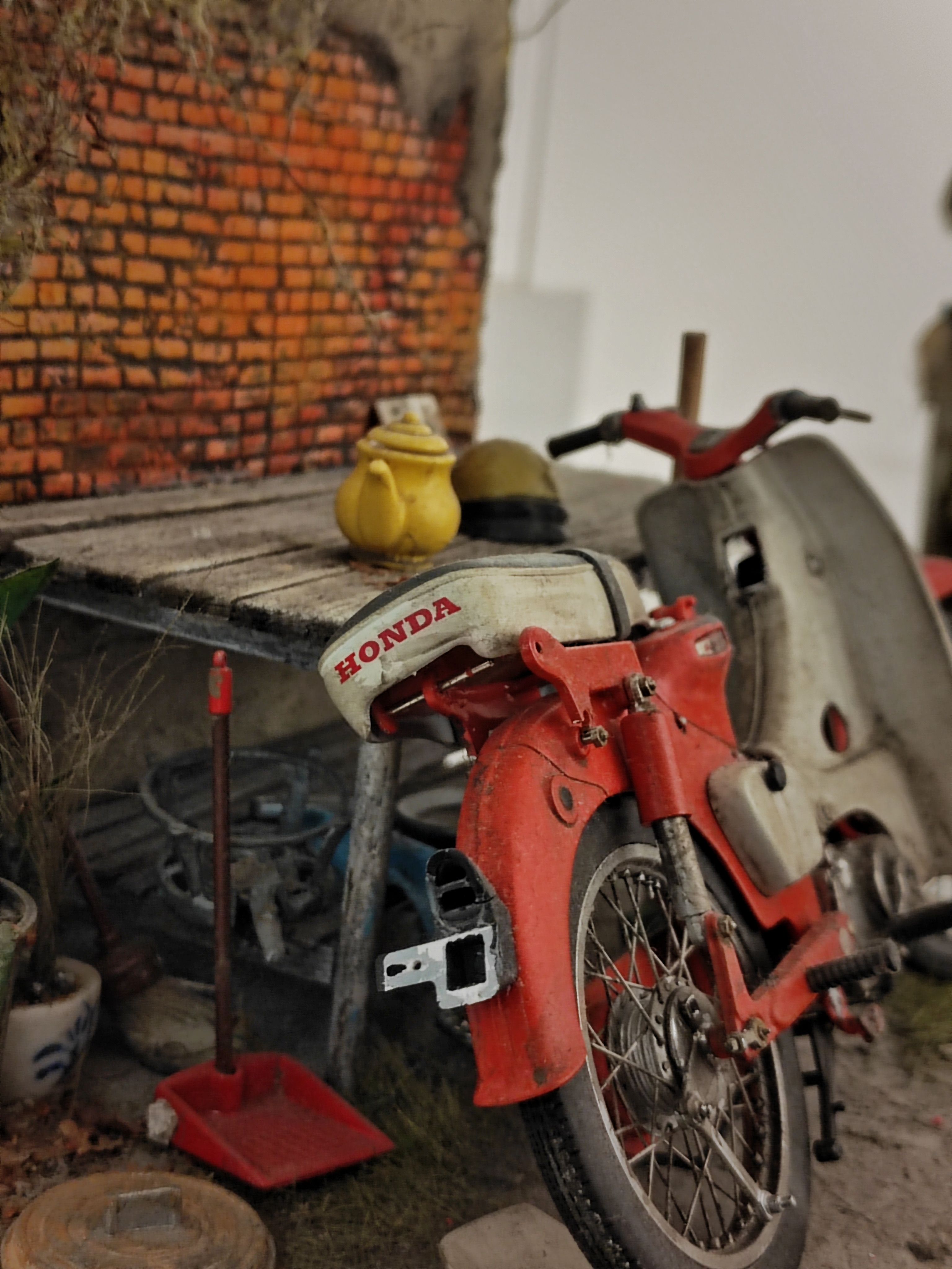 Vintage Red Motorcycle Against Brick Wall · Free Stock Photo