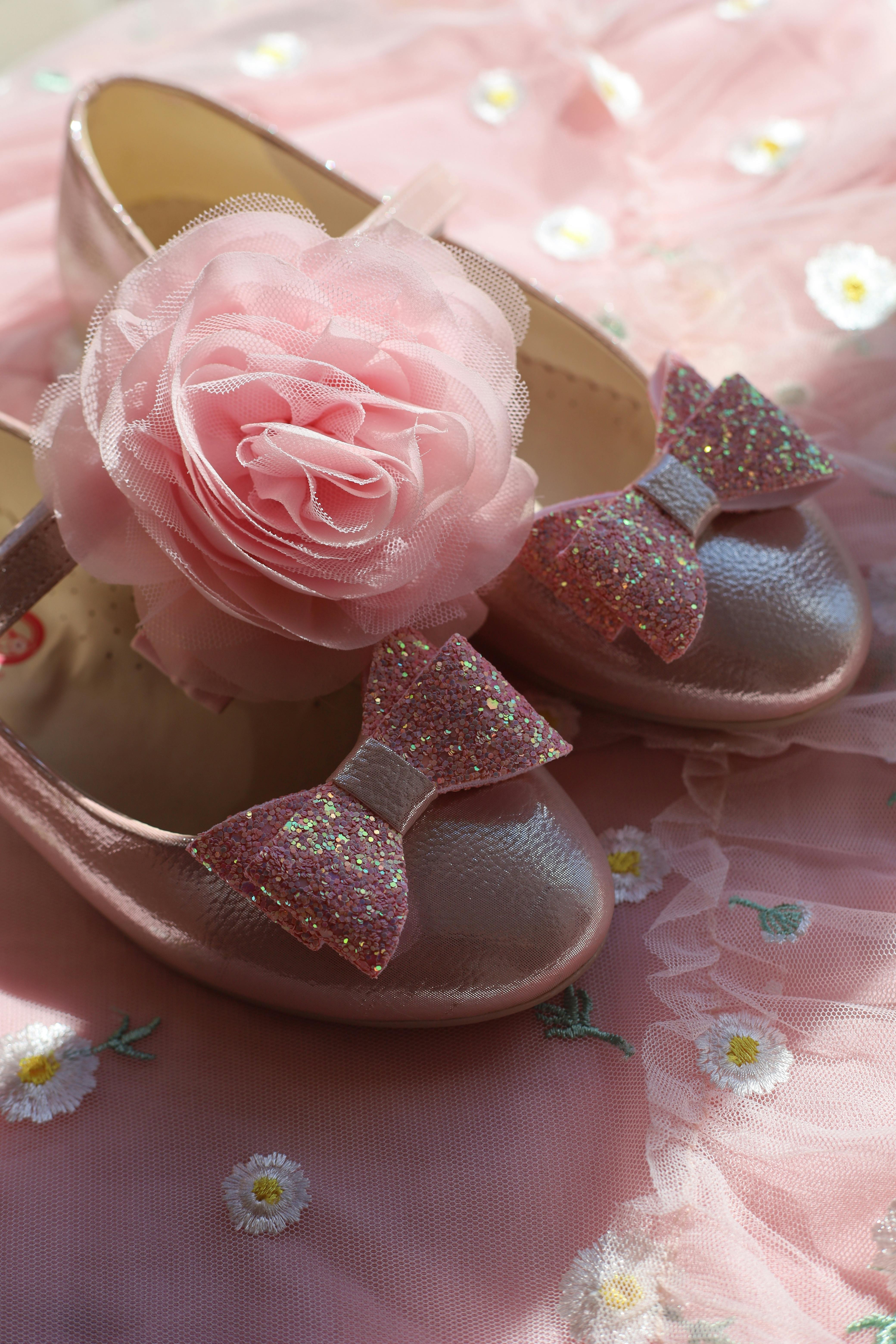 Delicate Pink Baby Shoes with Rose and Glitter Bows · Free Stock Photo