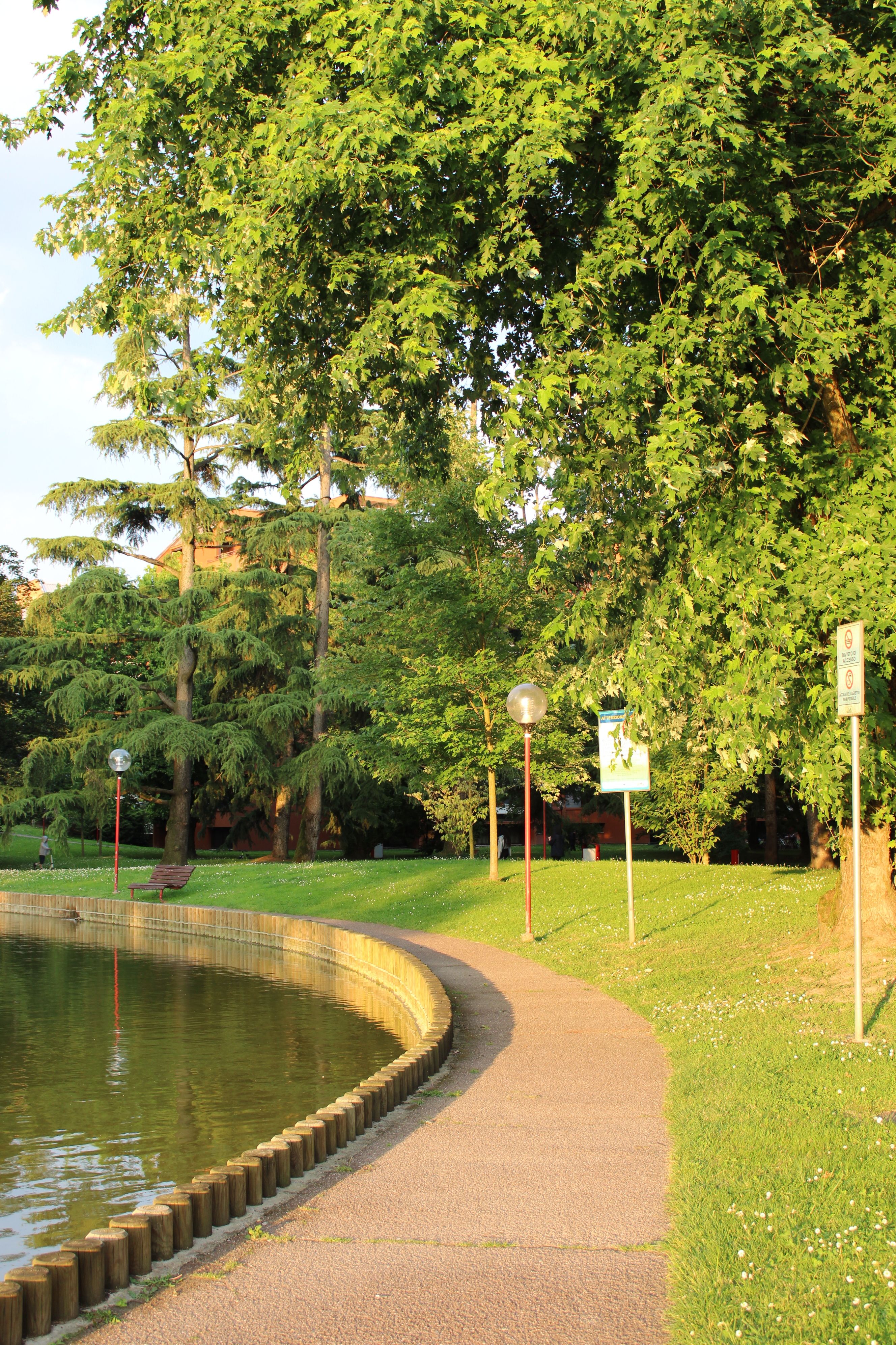 Serene Park Pathway by Lake in Milano · Free Stock Photo