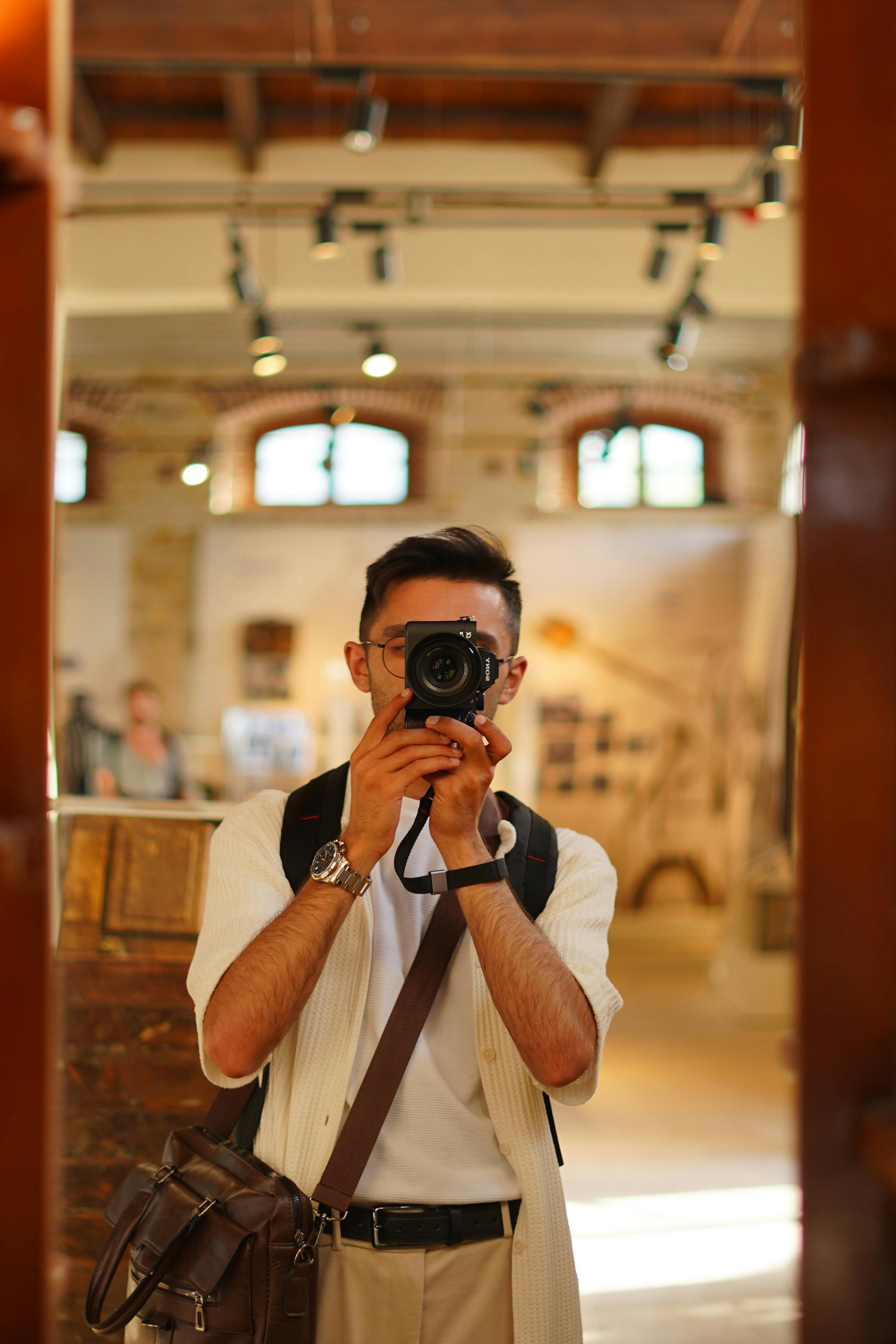 Photographer Captures Art Gallery Reflection · Free Stock Photo