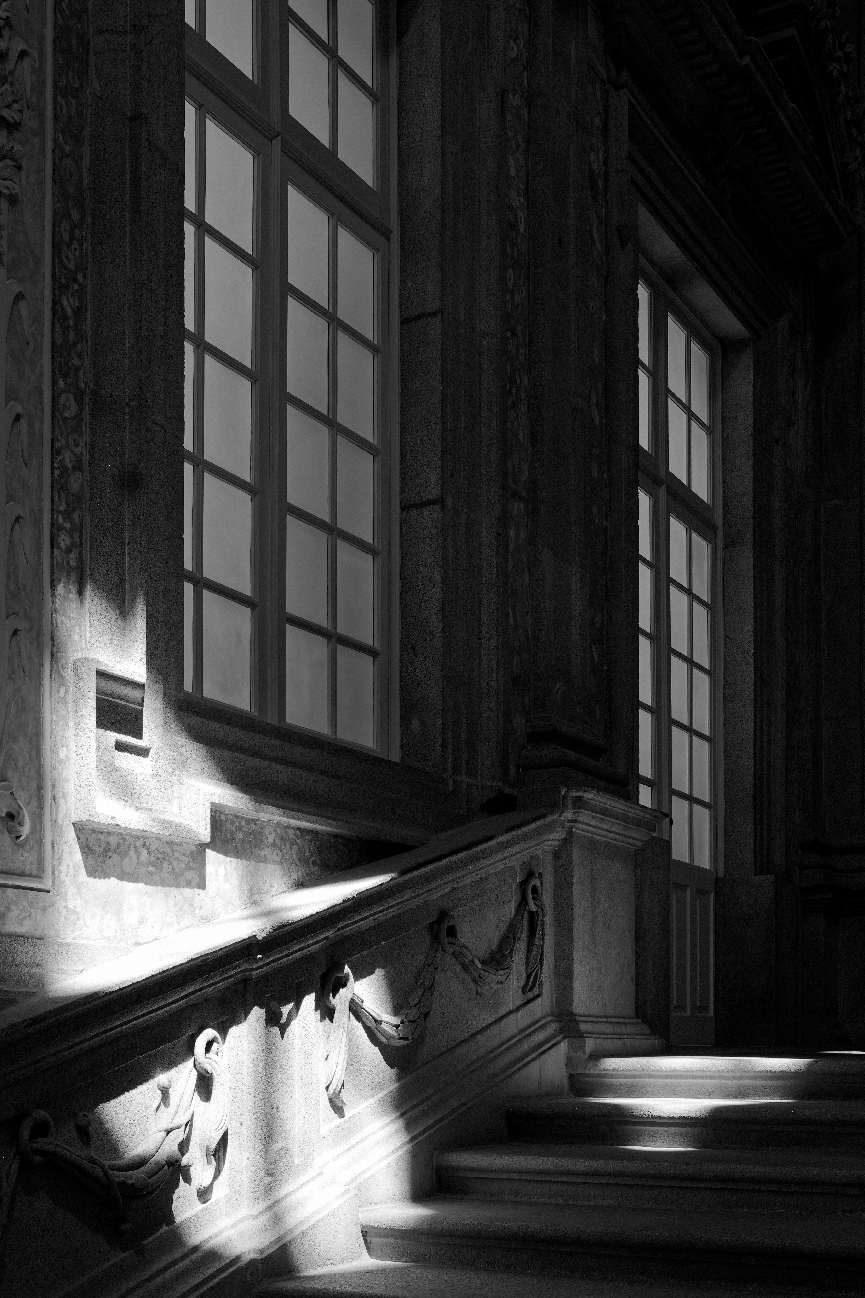 Elegant Architectural Interior with Sunlit Stairs · Free Stock Photo