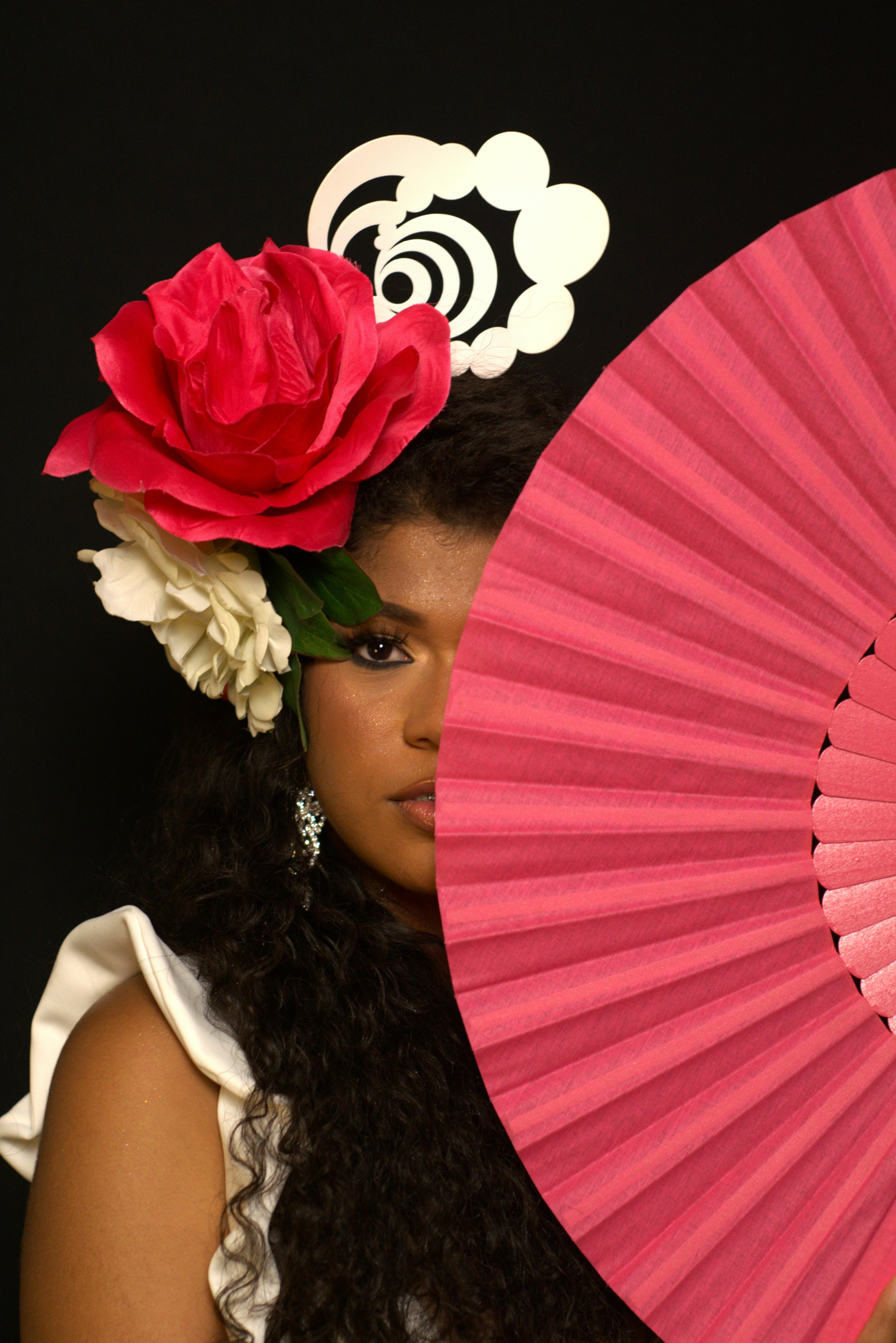 Elegant Portrait with Fan and Floral Headpiece · Free Stock Photo