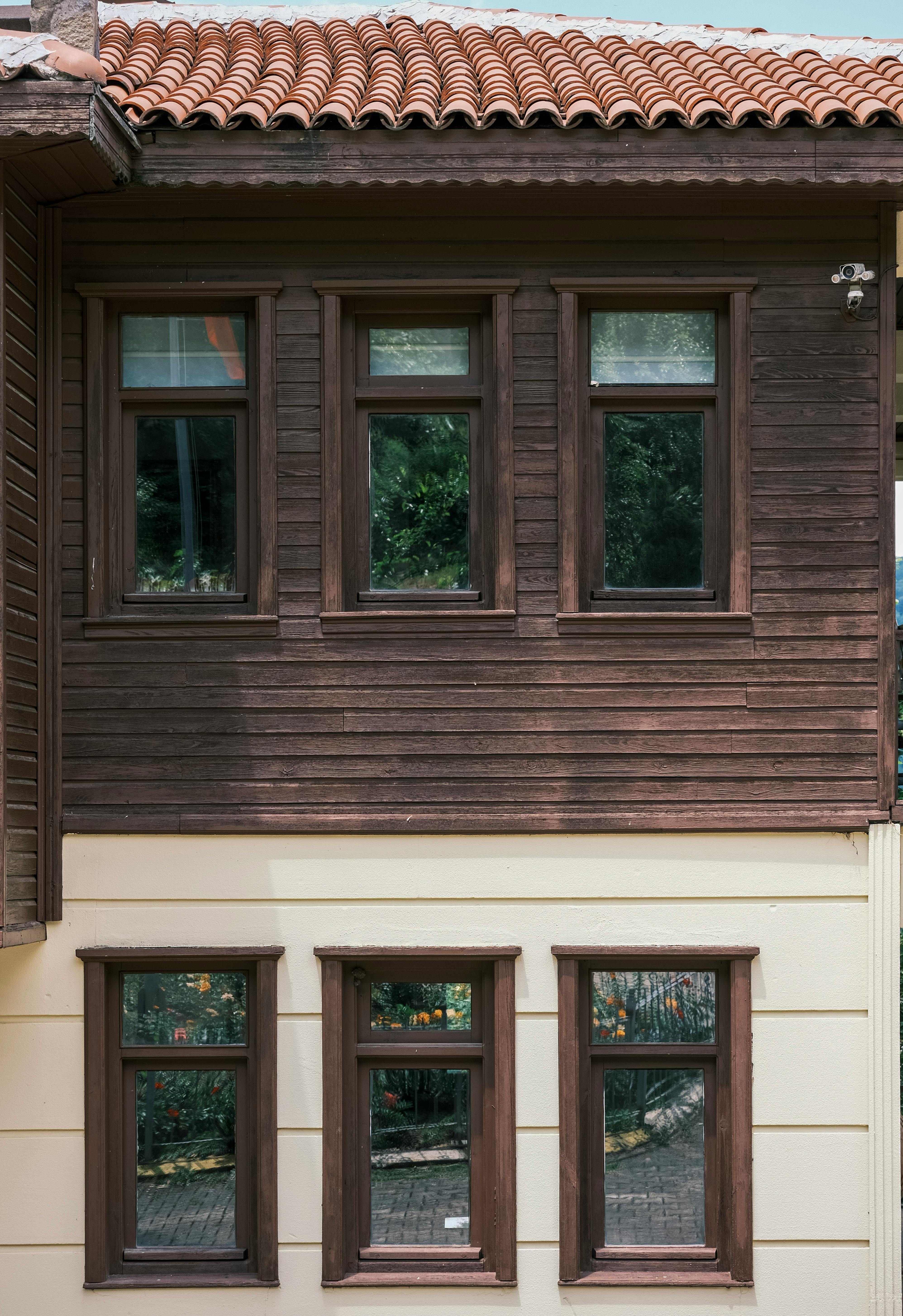 Rustic Wooden House Exterior with Windows · Free Stock Photo