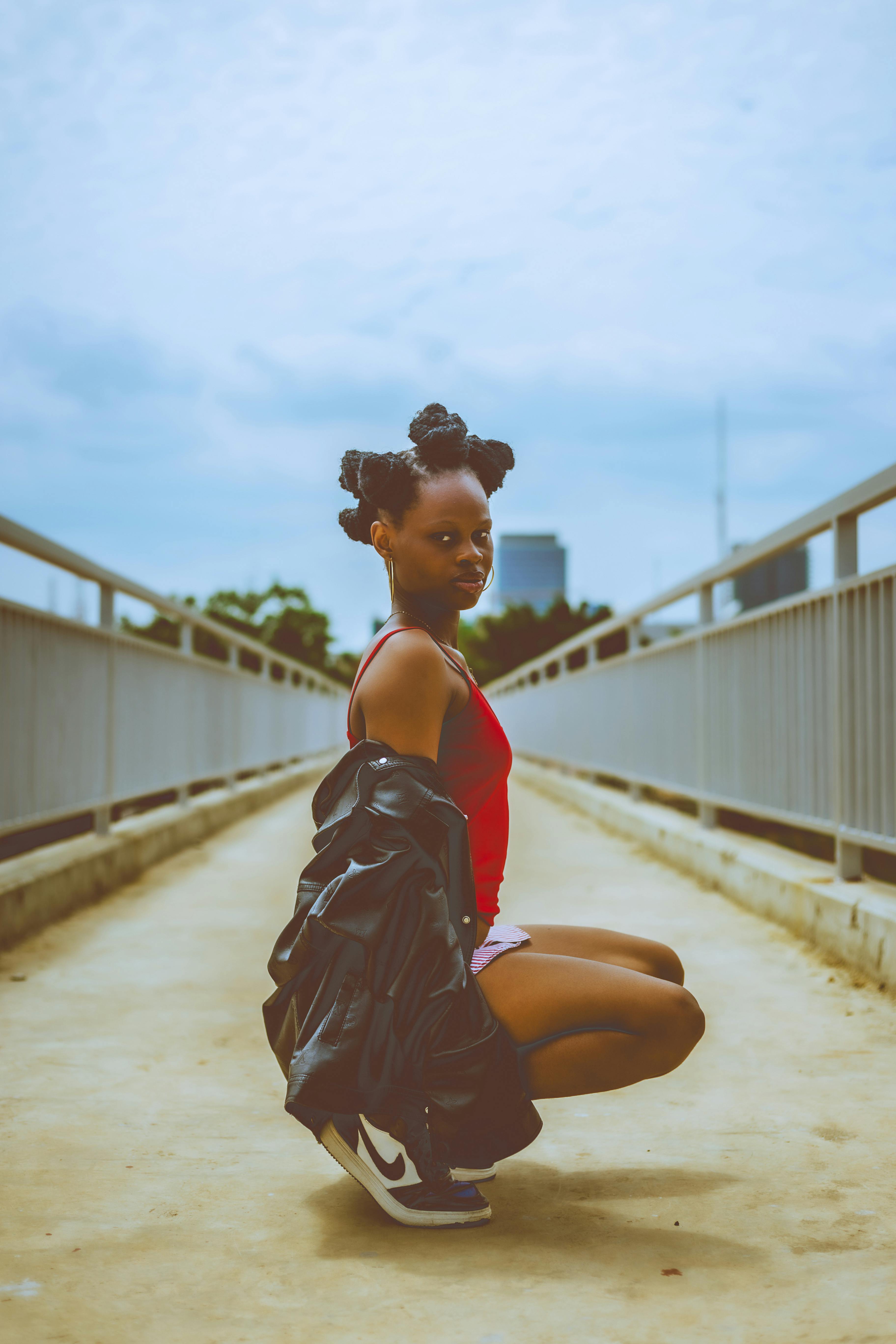 Stylish Young Woman on Urban Bridge · Free Stock Photo