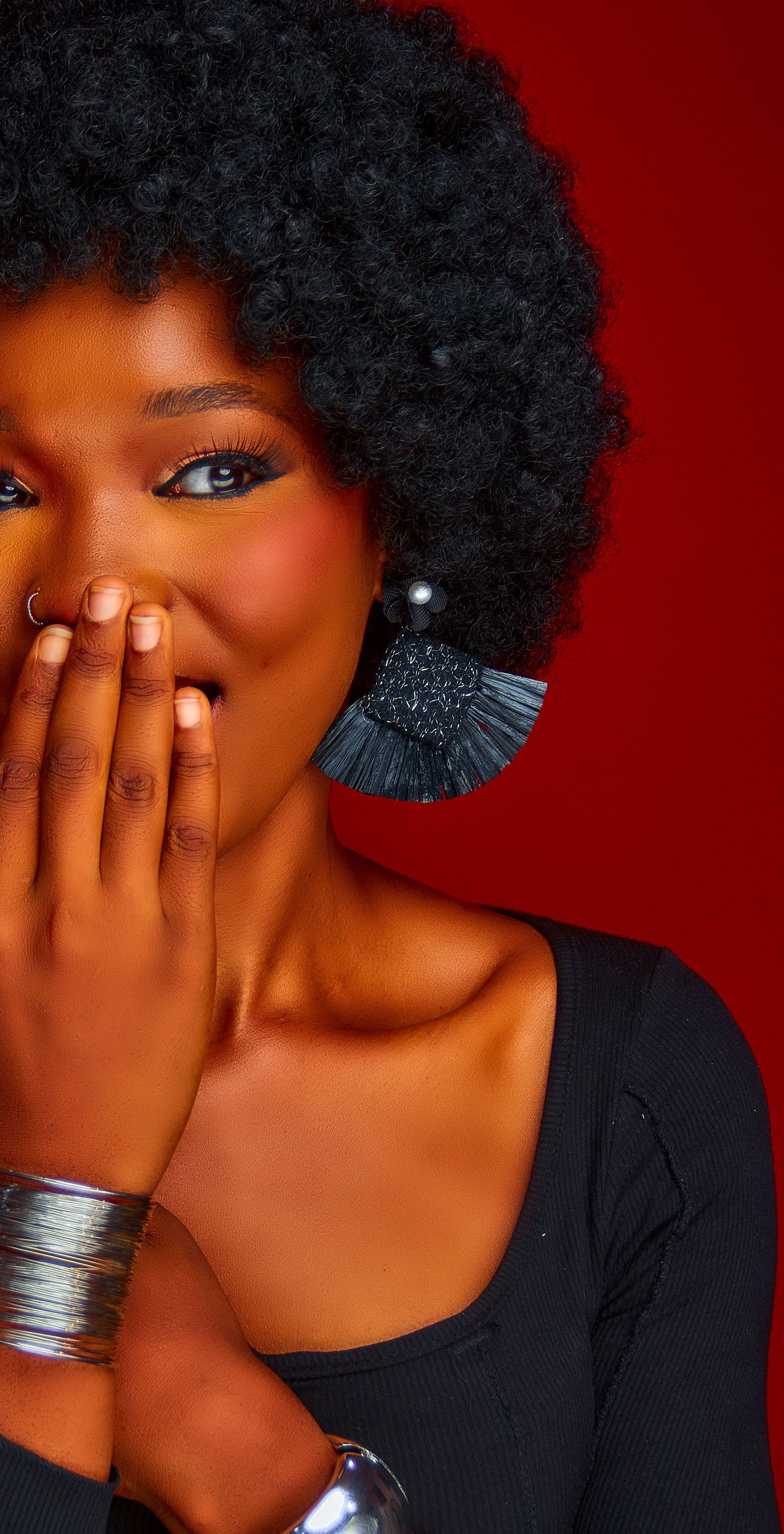 Half-Faced Woman Laughing with Afro Hairstyle · Free Stock Photo