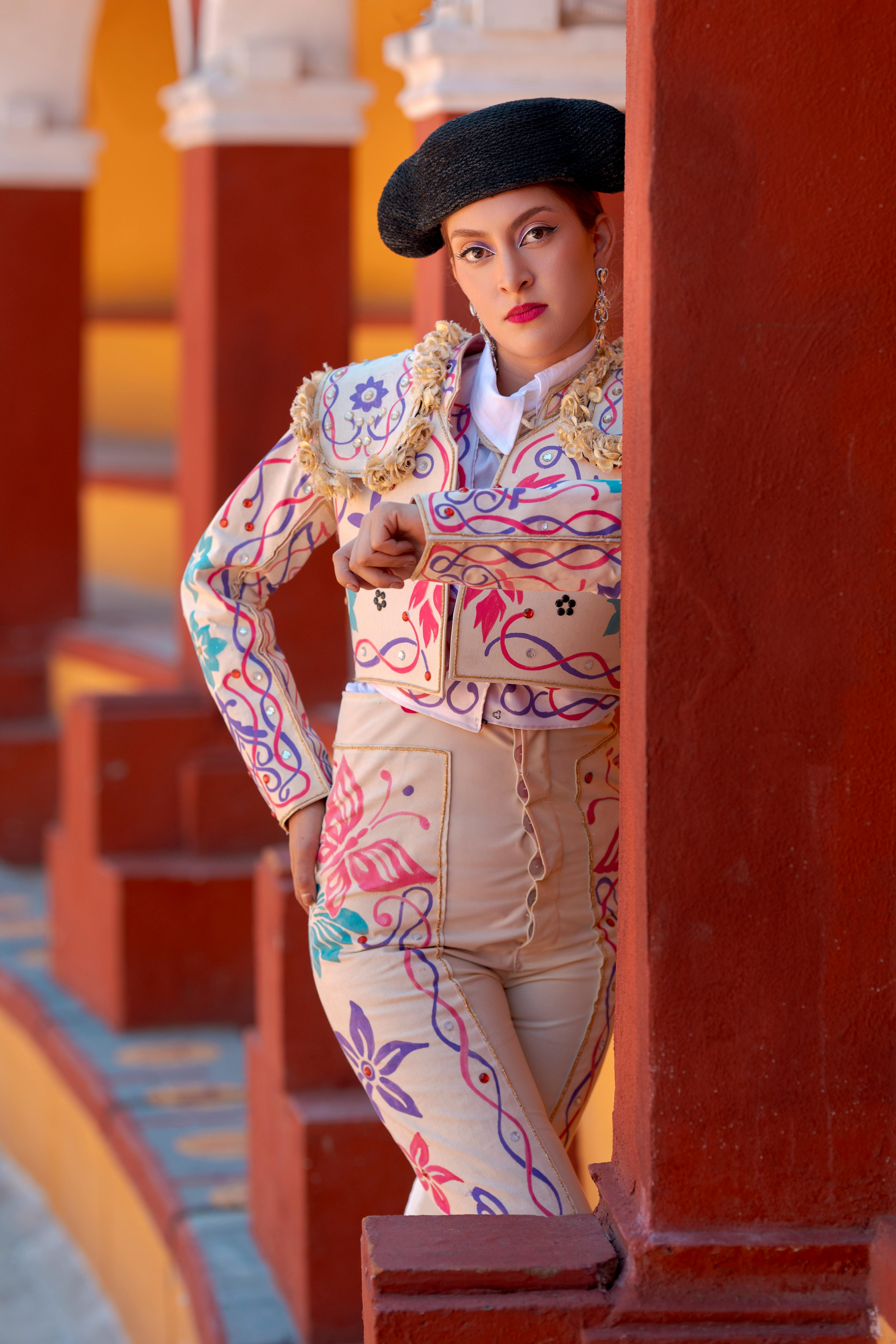 Colorful Bullfighter Costume in Traditional Setting · Free Stock Photo
