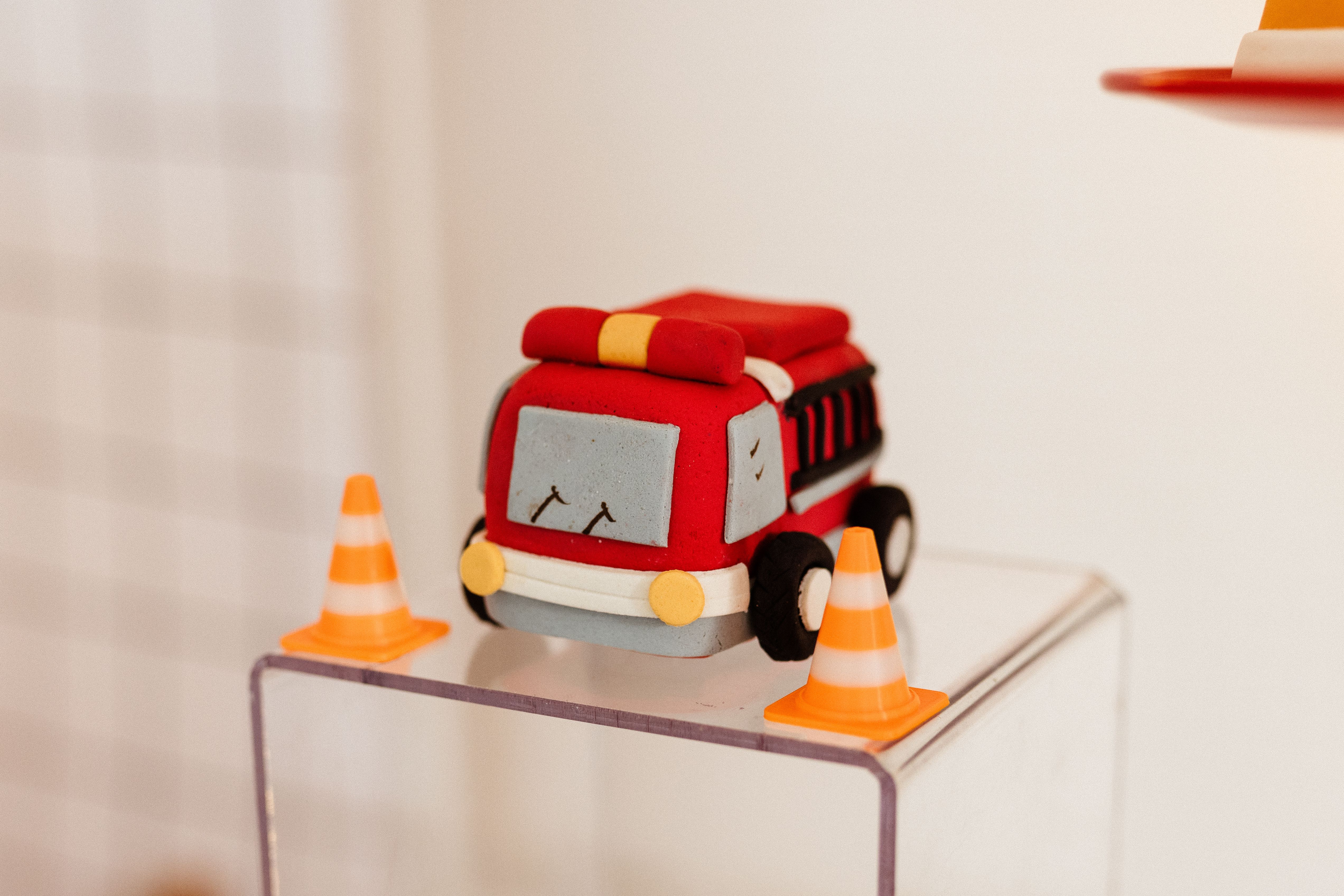 Colorful Toy Fire Truck with Safety Cones · Free Stock Photo