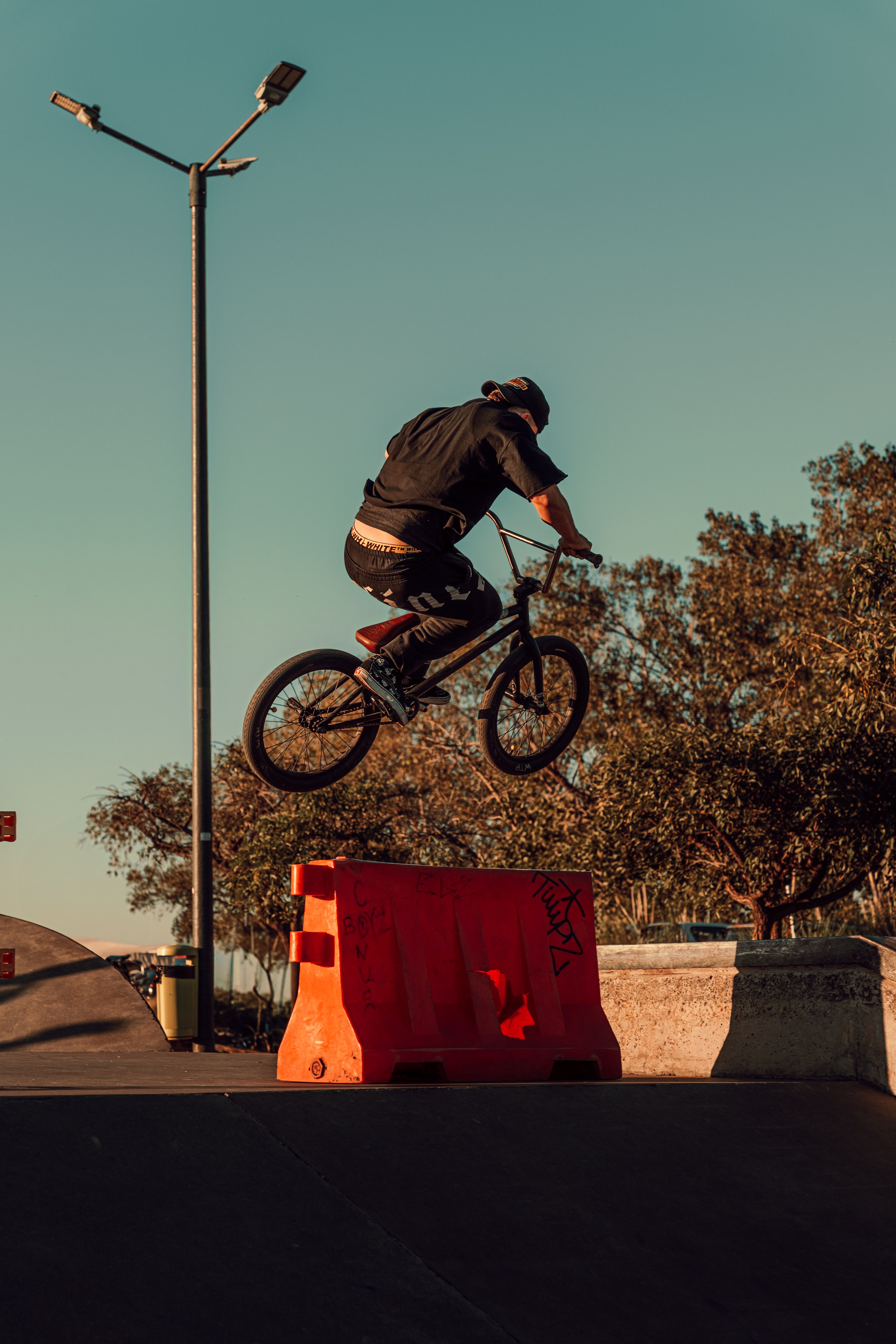 BMX Rider Performing Stunt at Outdoor Skatepark · Free Stock Photo
