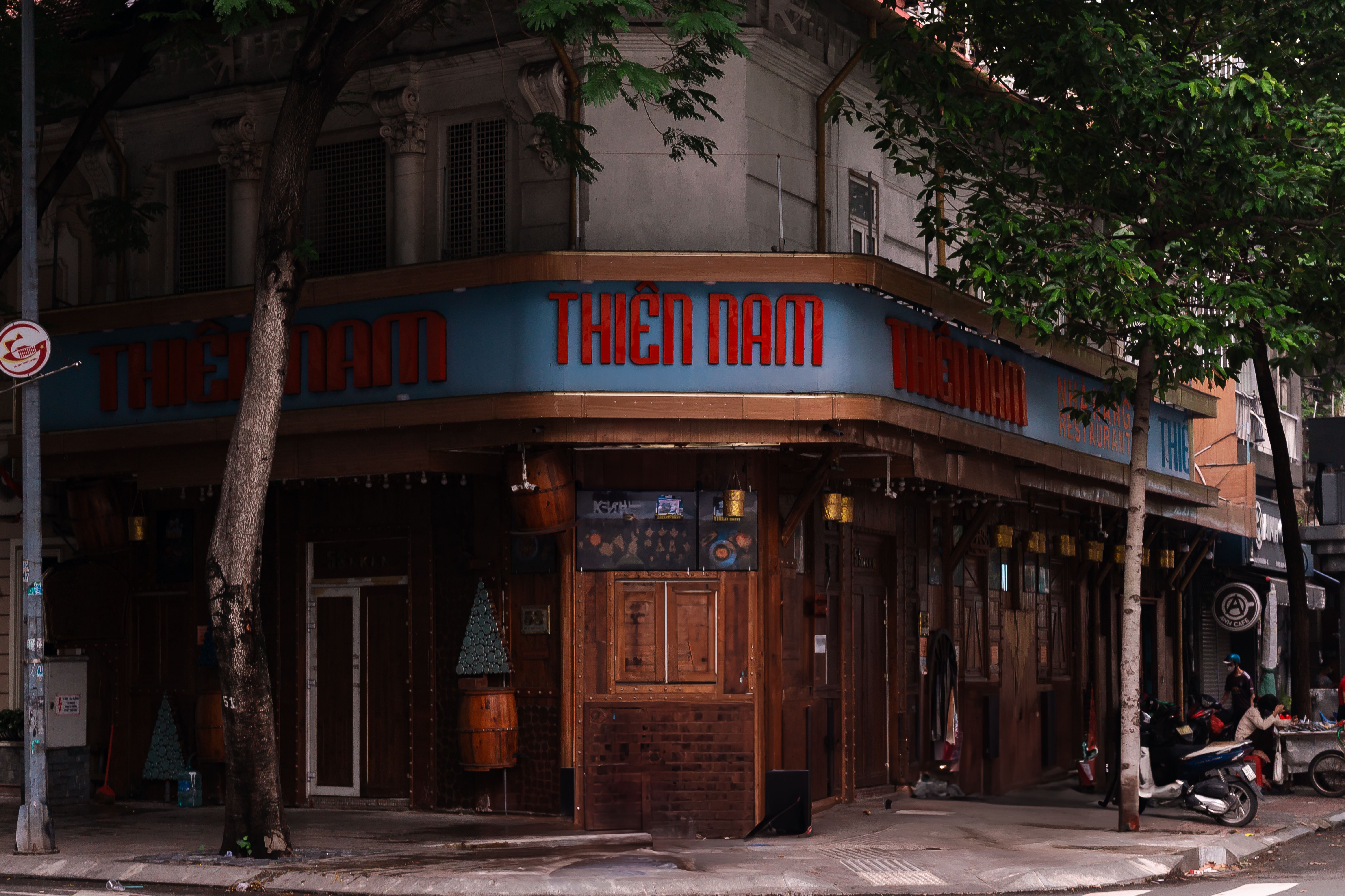 Corner Cafe with Signage in Urban Setting · Free Stock Photo
