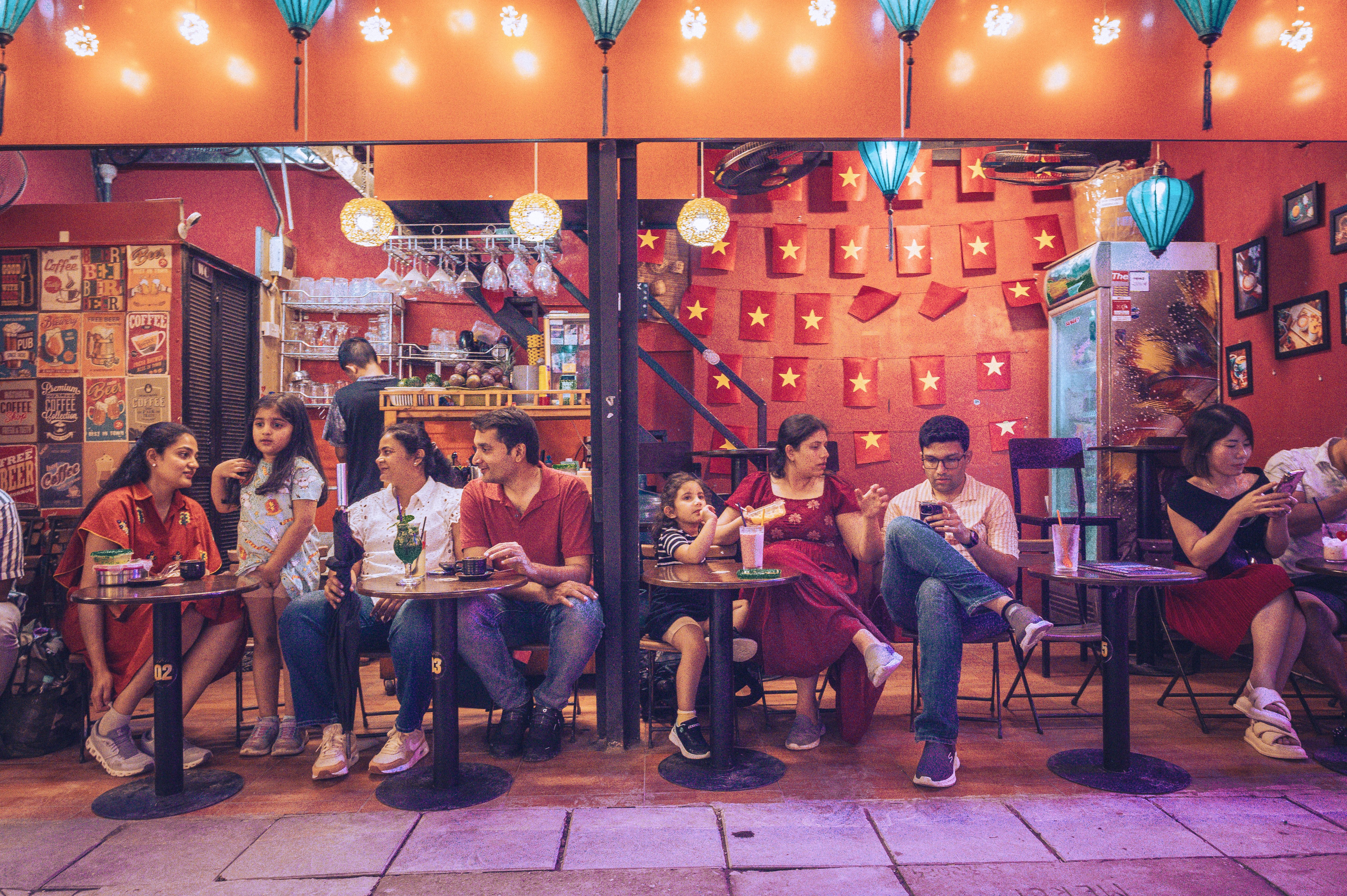 Candid Street Café Scene with Diverse Group · Free Stock Photo