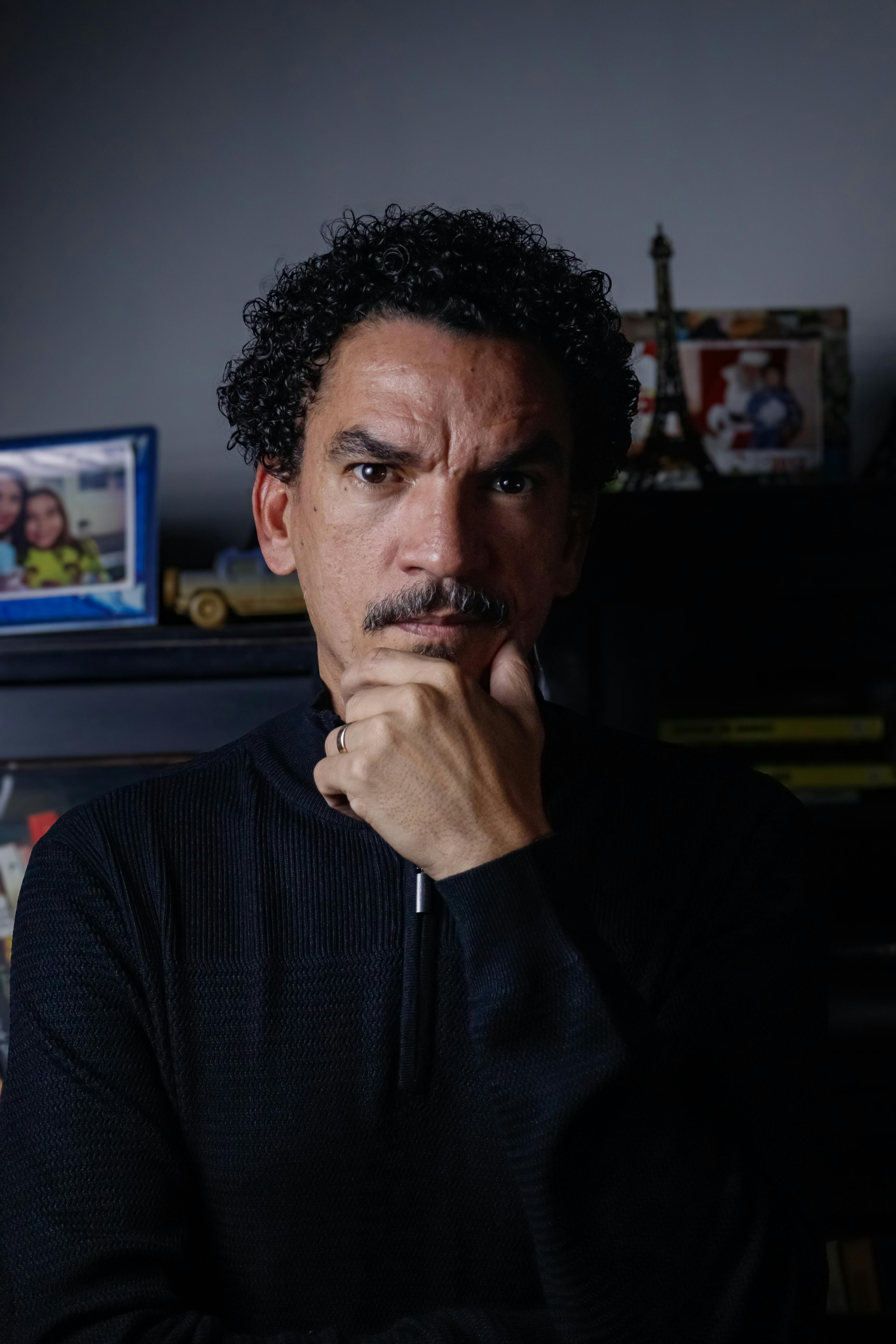 Pensive Man in Dark Room Portrait · Free Stock Photo