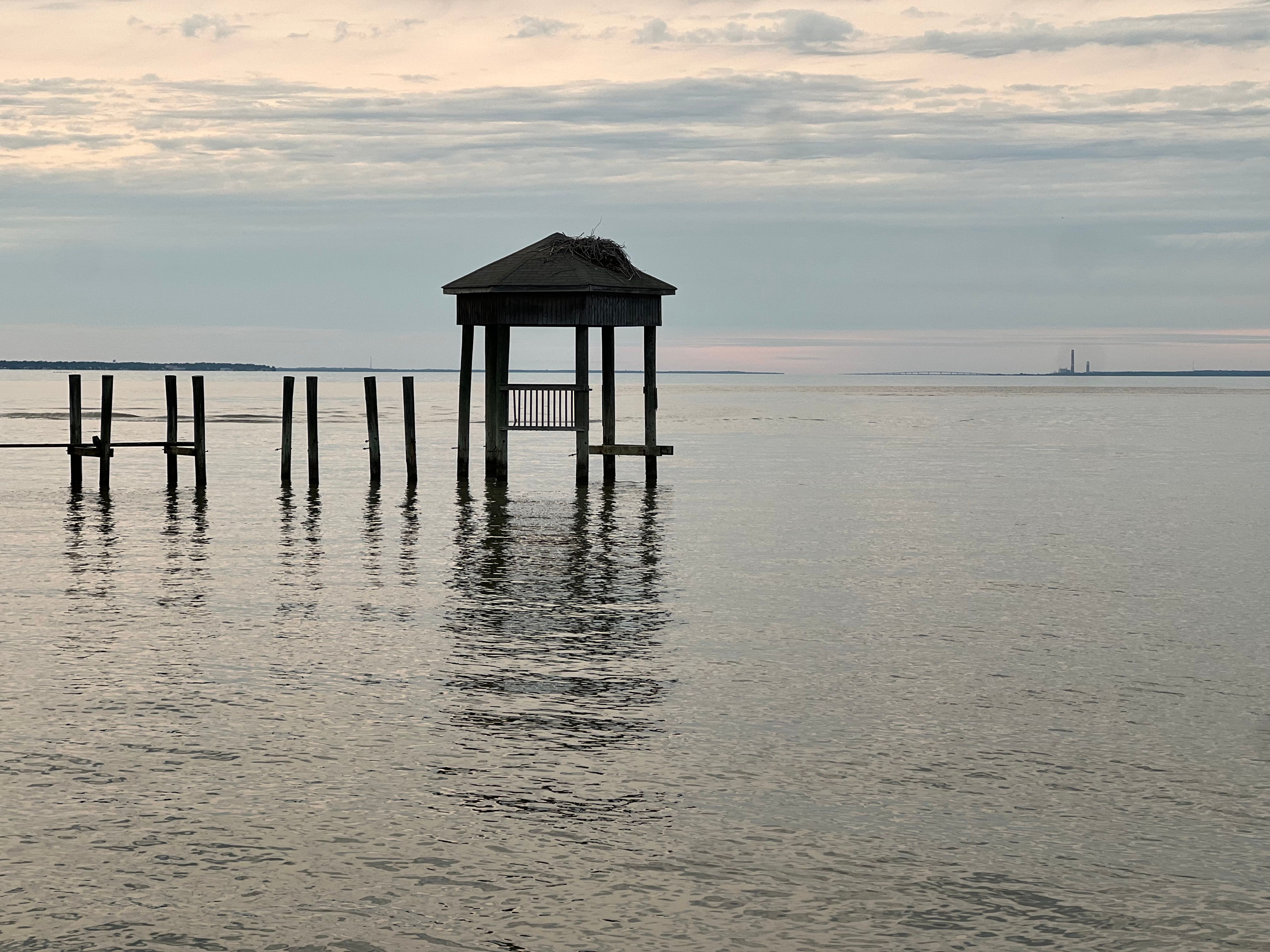 Tranquil Waterfront View with Pier Structure · Free Stock Photo