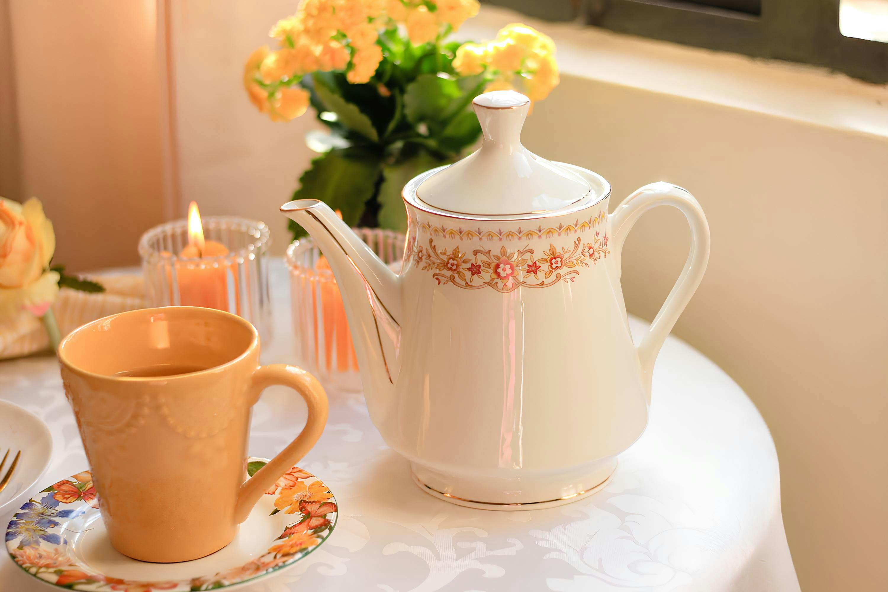 Elegant Tea Time Setting with Floral Decor · Free Stock Photo
