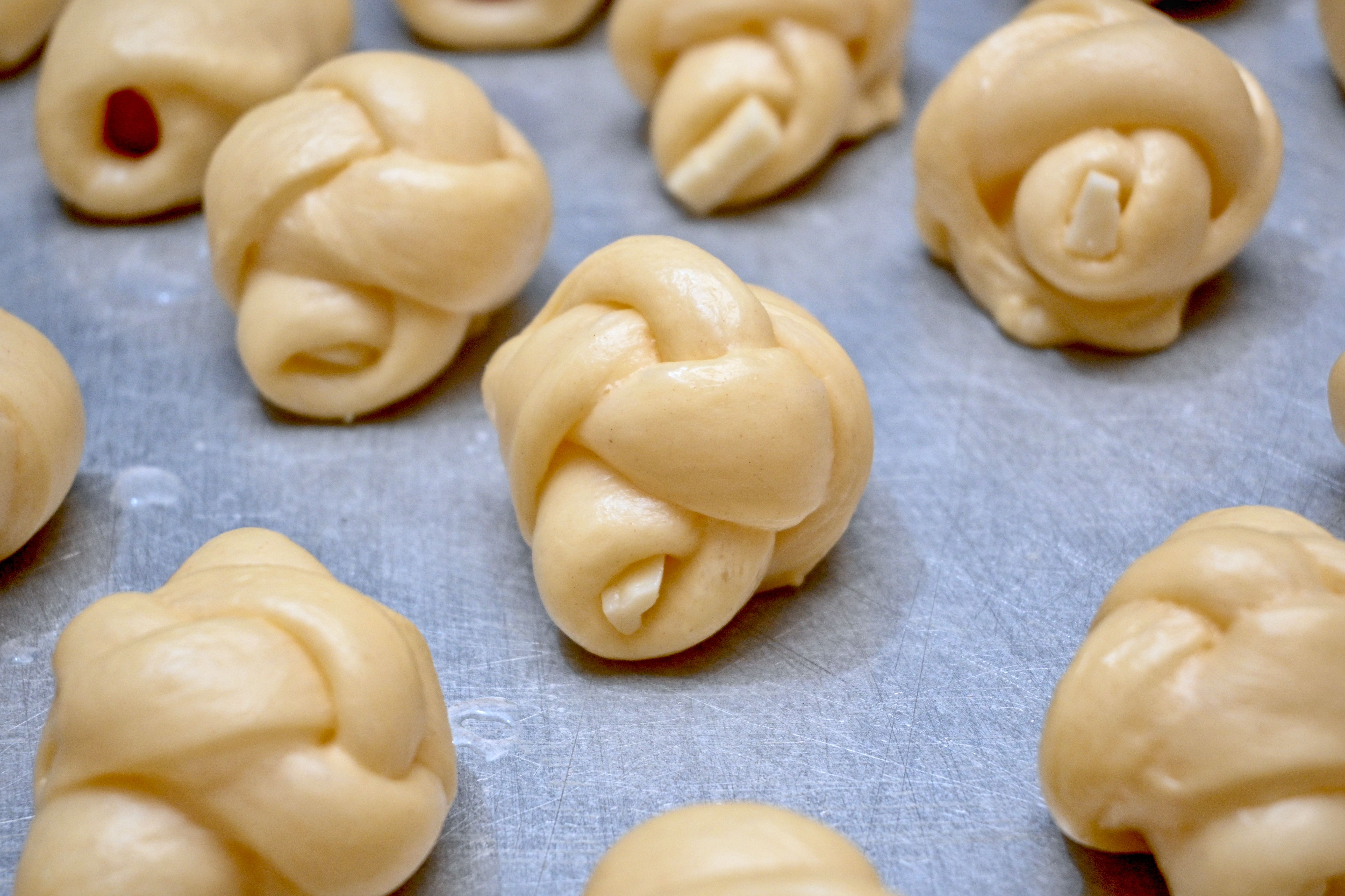 Freshly Knotted Dough on Baking Sheet · Free Stock Photo