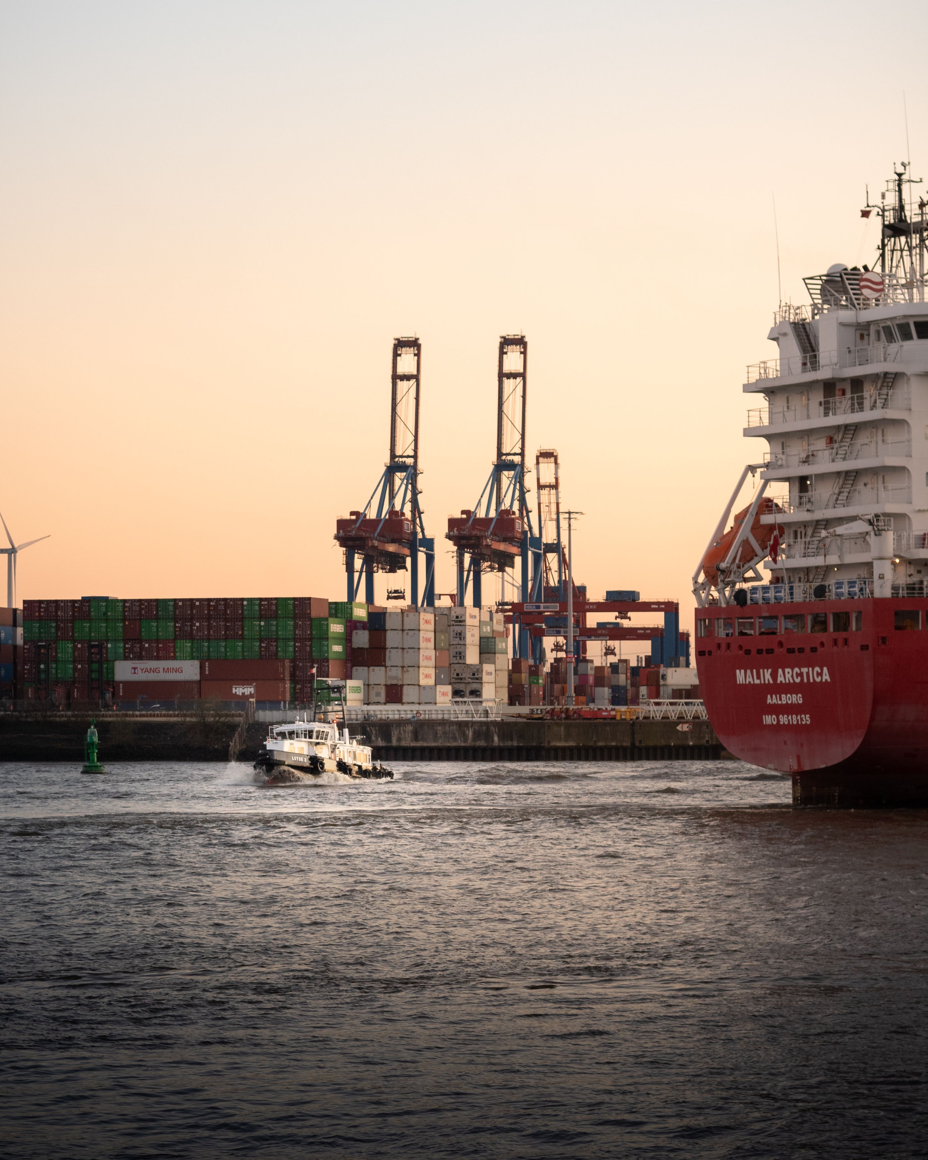 Cargo Ship at Hamburg Harbor during Sunset · Free Stock Photo