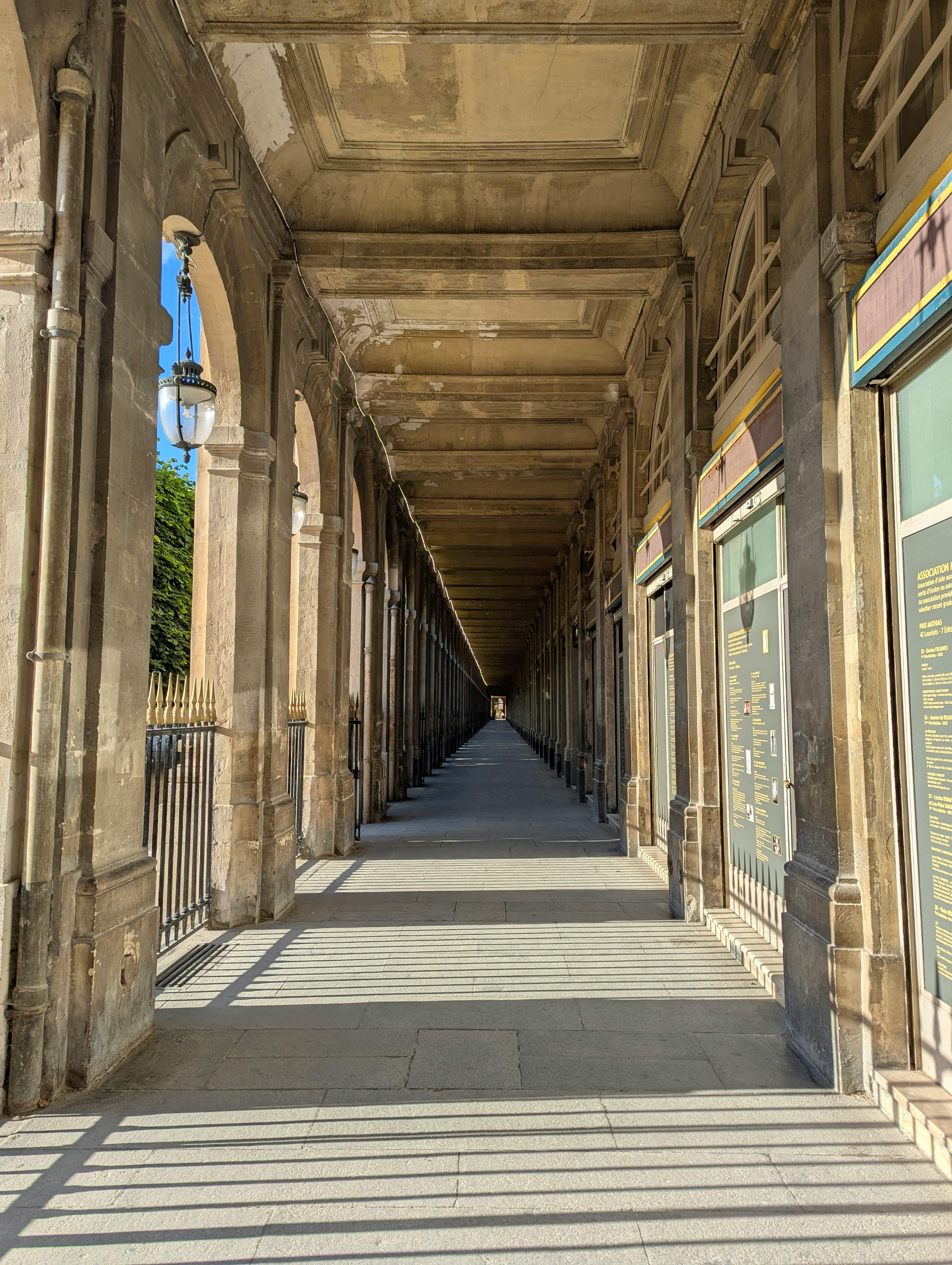 Historic Parisian Arcade with Classical Architecture · Free Stock Photo