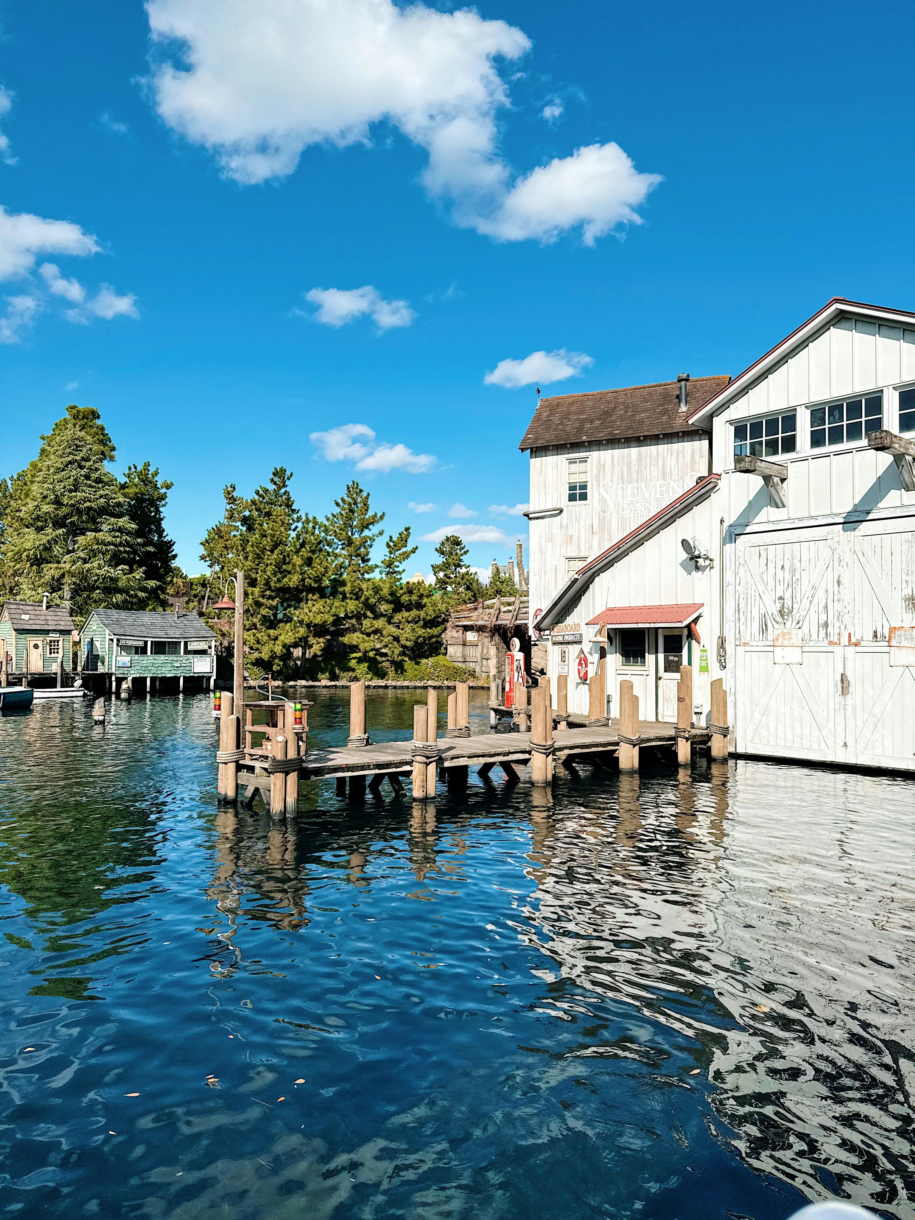 Charming Waterfront Dock and Rustic Boathouse · Free Stock Photo