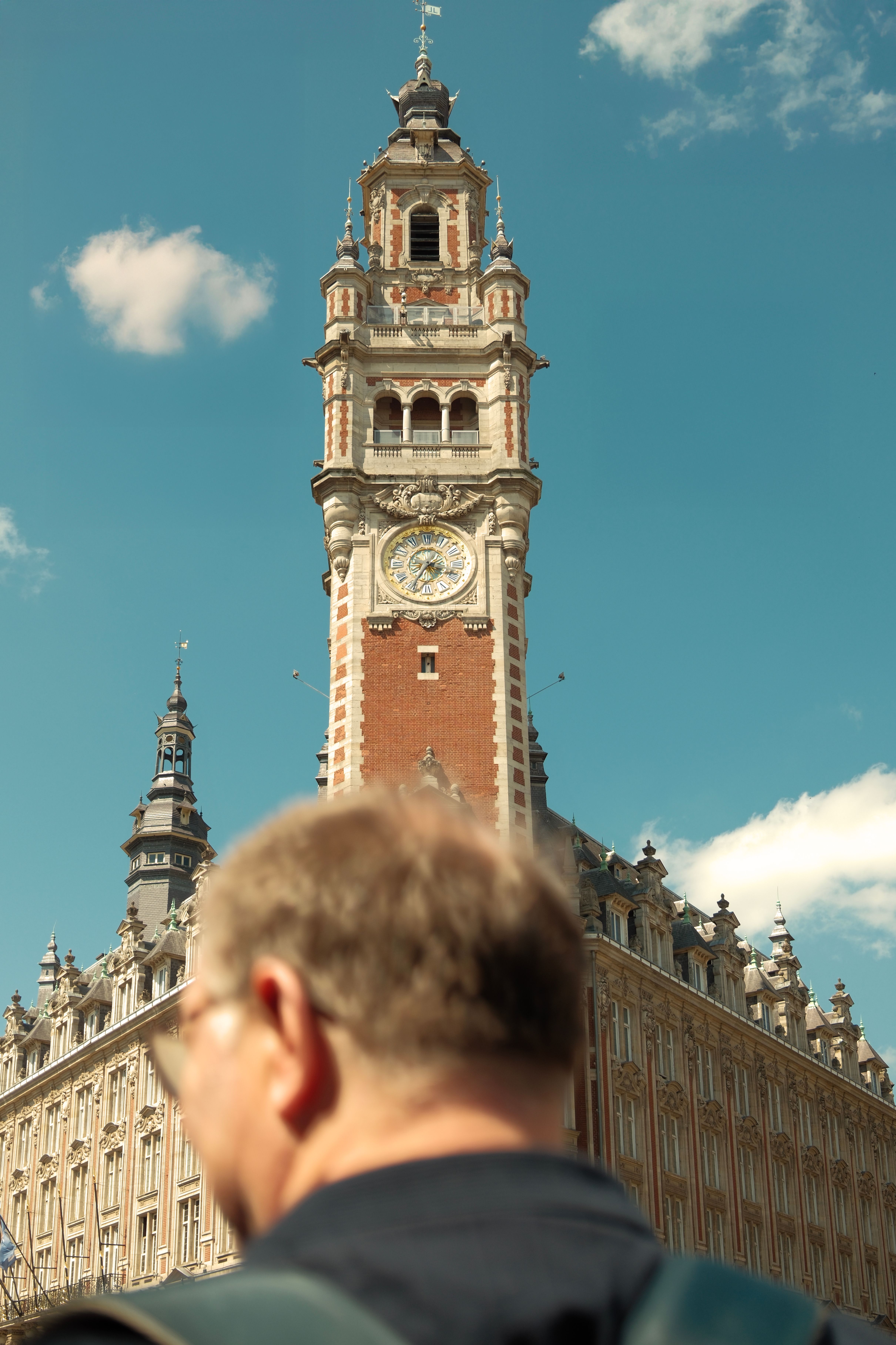 Bell tower against a clear sky in Lille, France · Free Stock Photo