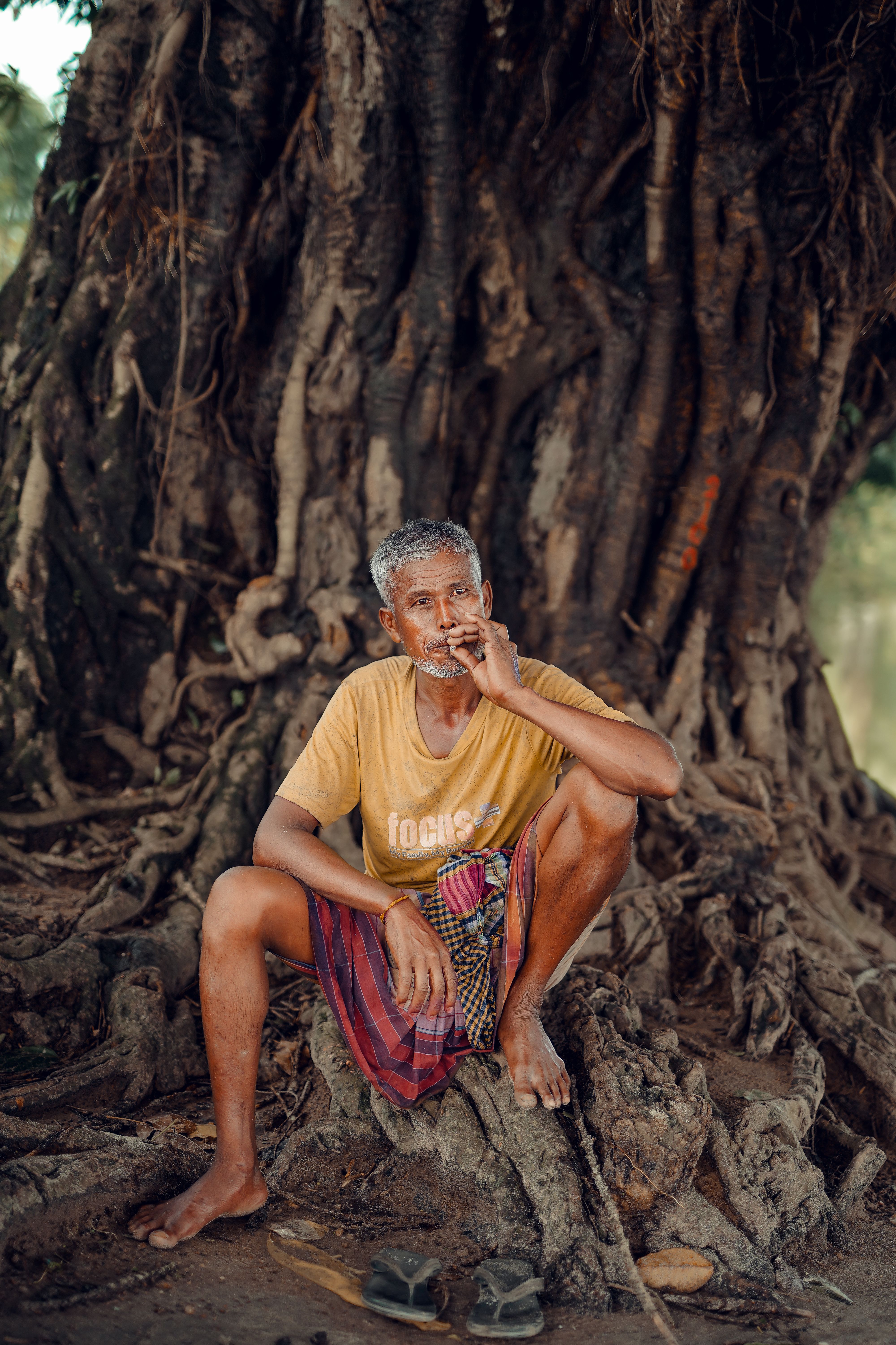 Bangladeshi Man Sitting by Banyan Tree · Free Stock Photo