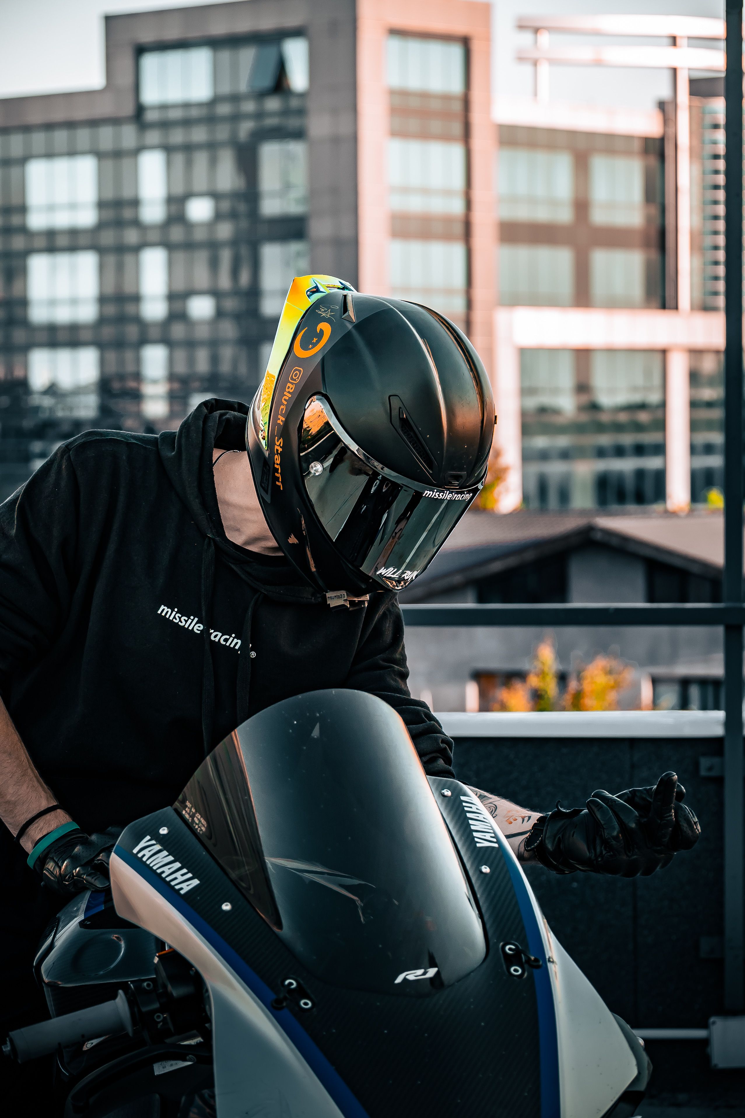 Urban Biker with Helmet on a Sports Motorcycle · Free Stock Photo