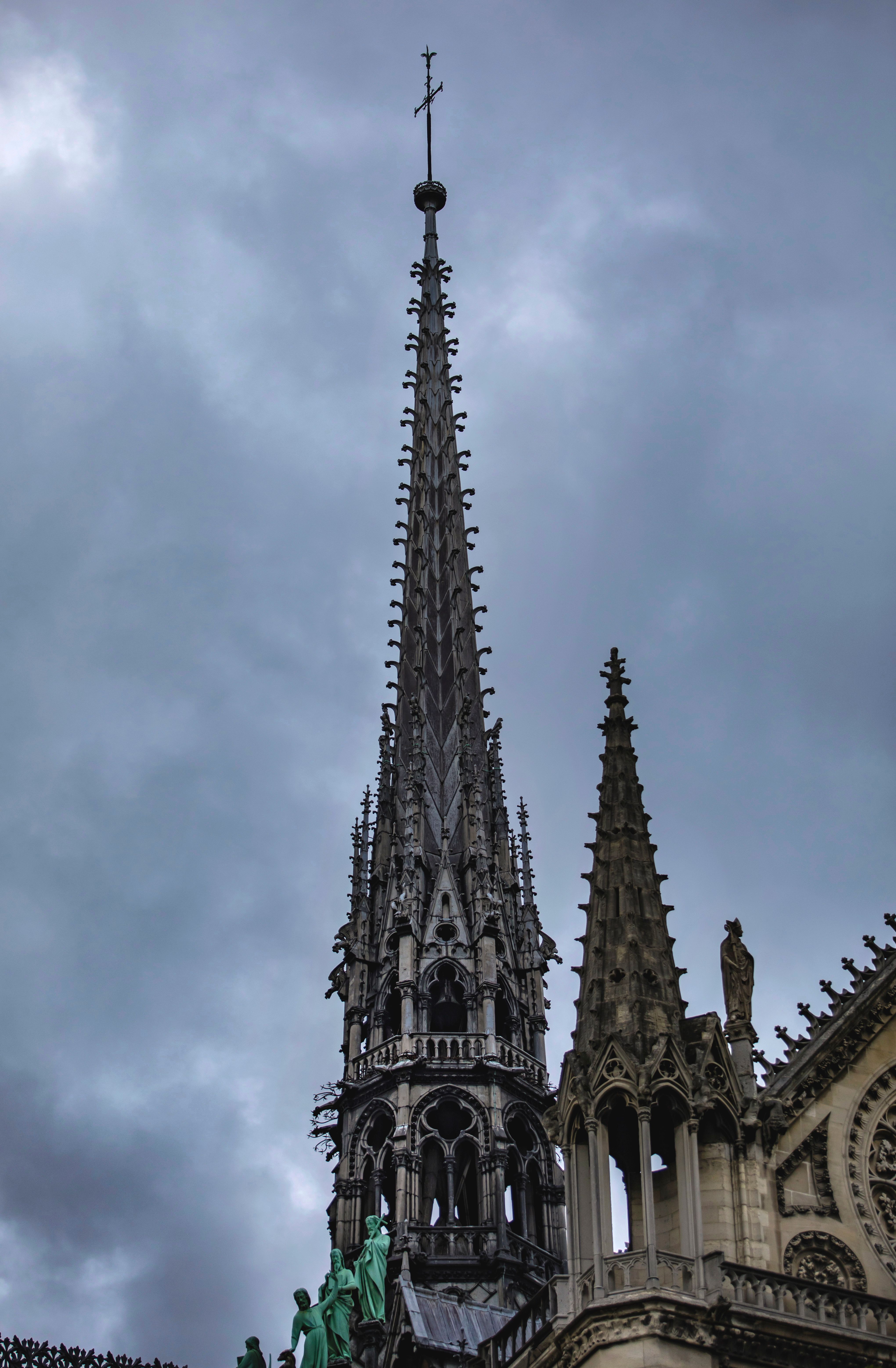 Majestic Gothic Cathedral Spire Against Dramatic Sky · Free Stock Photo