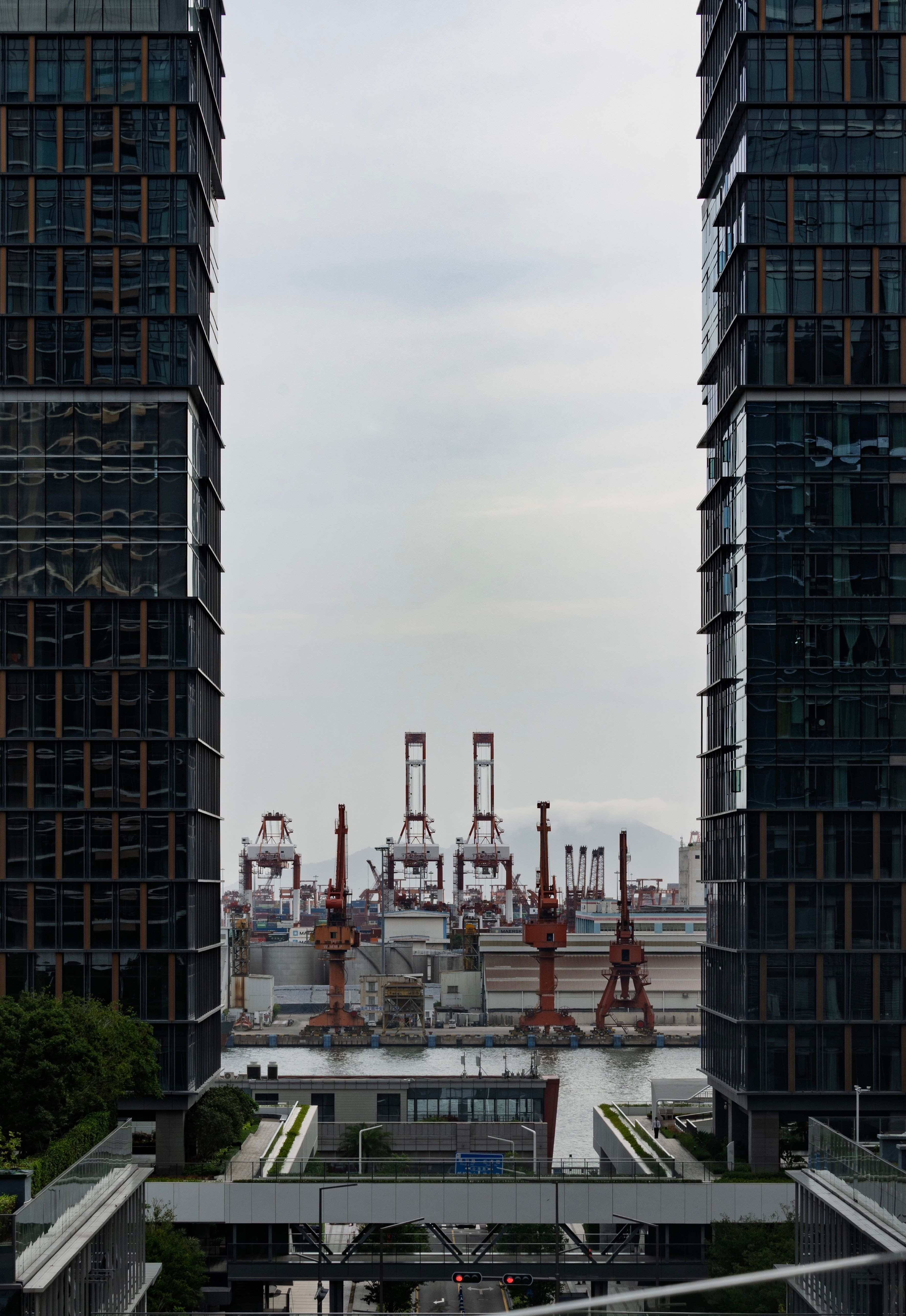 Modern Cityscape with Port and Cranes · Free Stock Photo