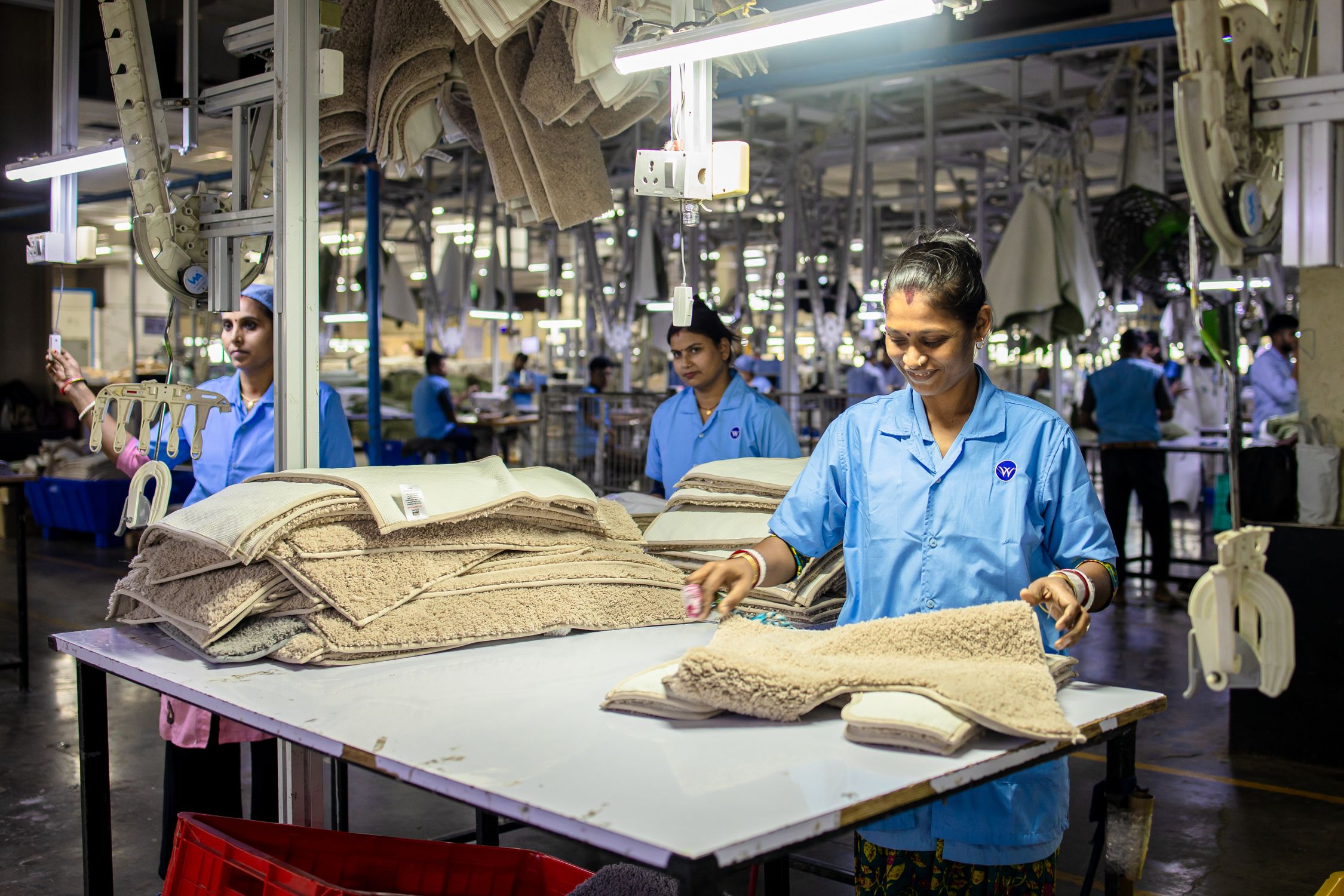 Textile Factory Workers Sorting Carpet Mats · Free Stock Photo