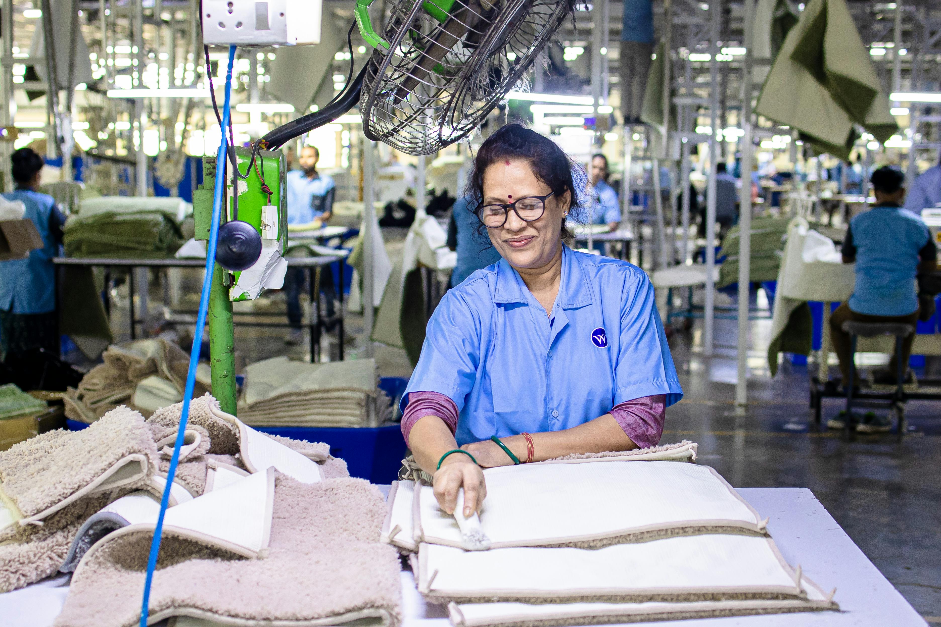 Woman Working in Textile Factory Smiling · Free Stock Photo