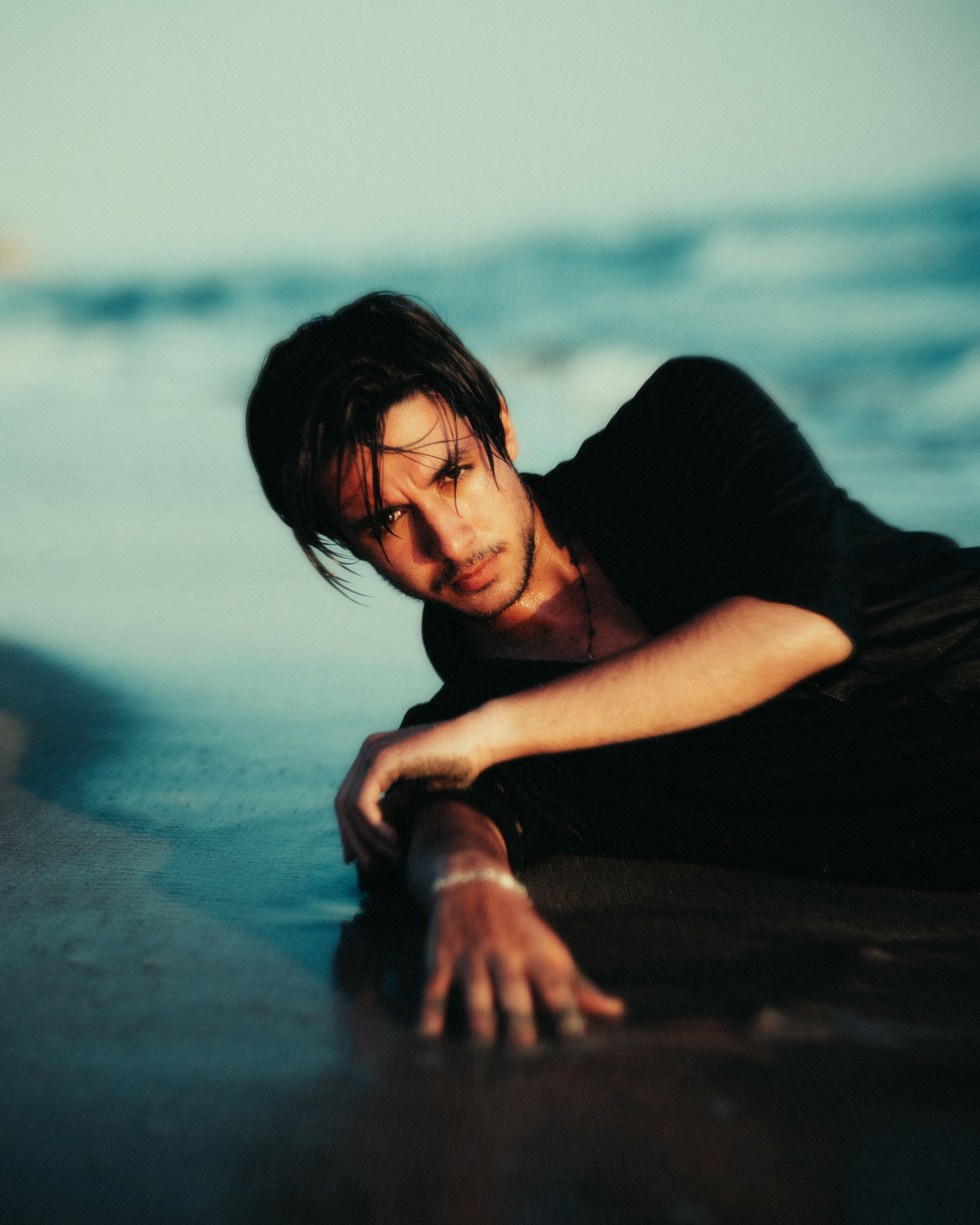 Dramatic Beach Portrait of a Young Man at Dusk · Free Stock Photo