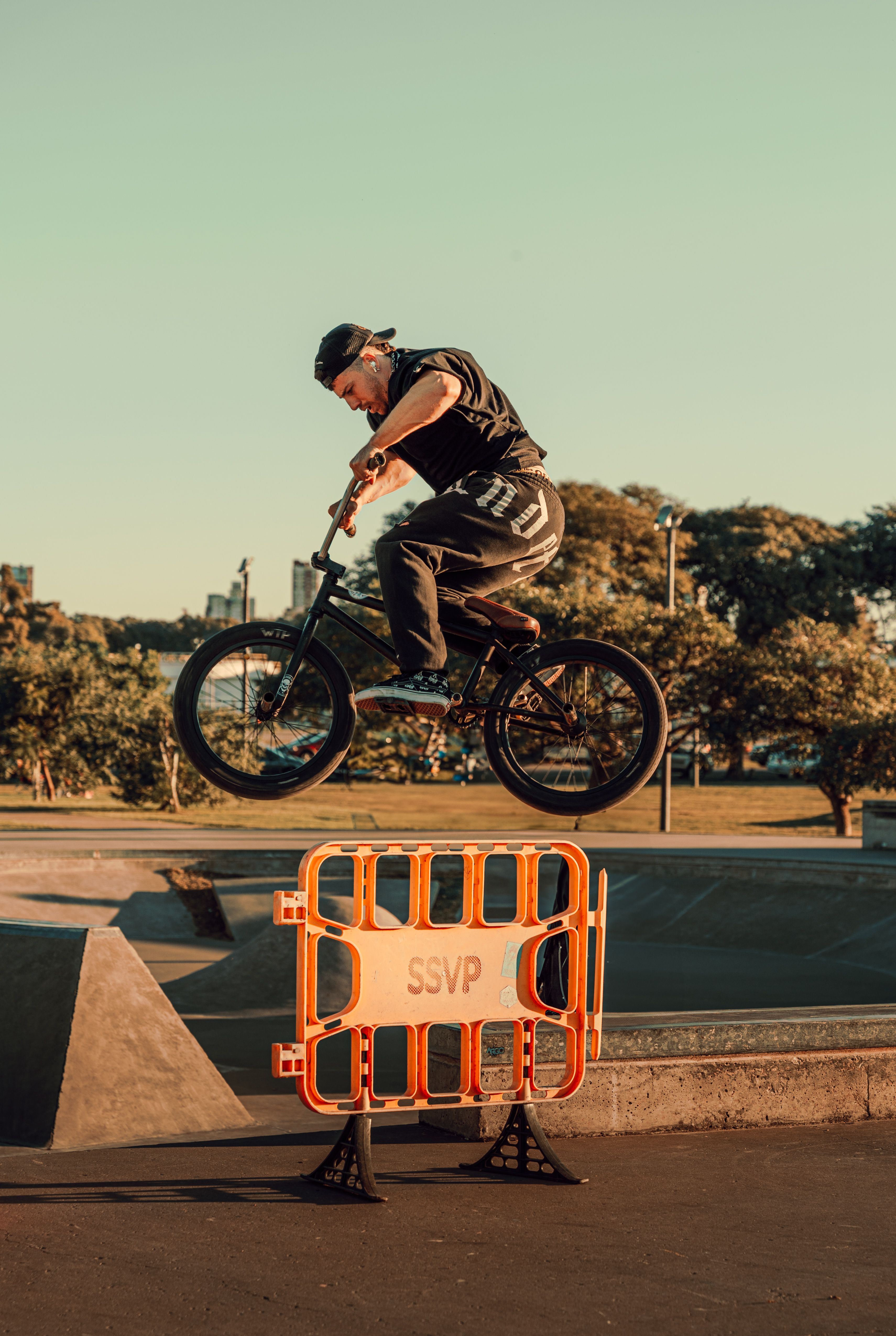 Dynamic BMX Stunt Over Obstacle at Skatepark · Free Stock Photo