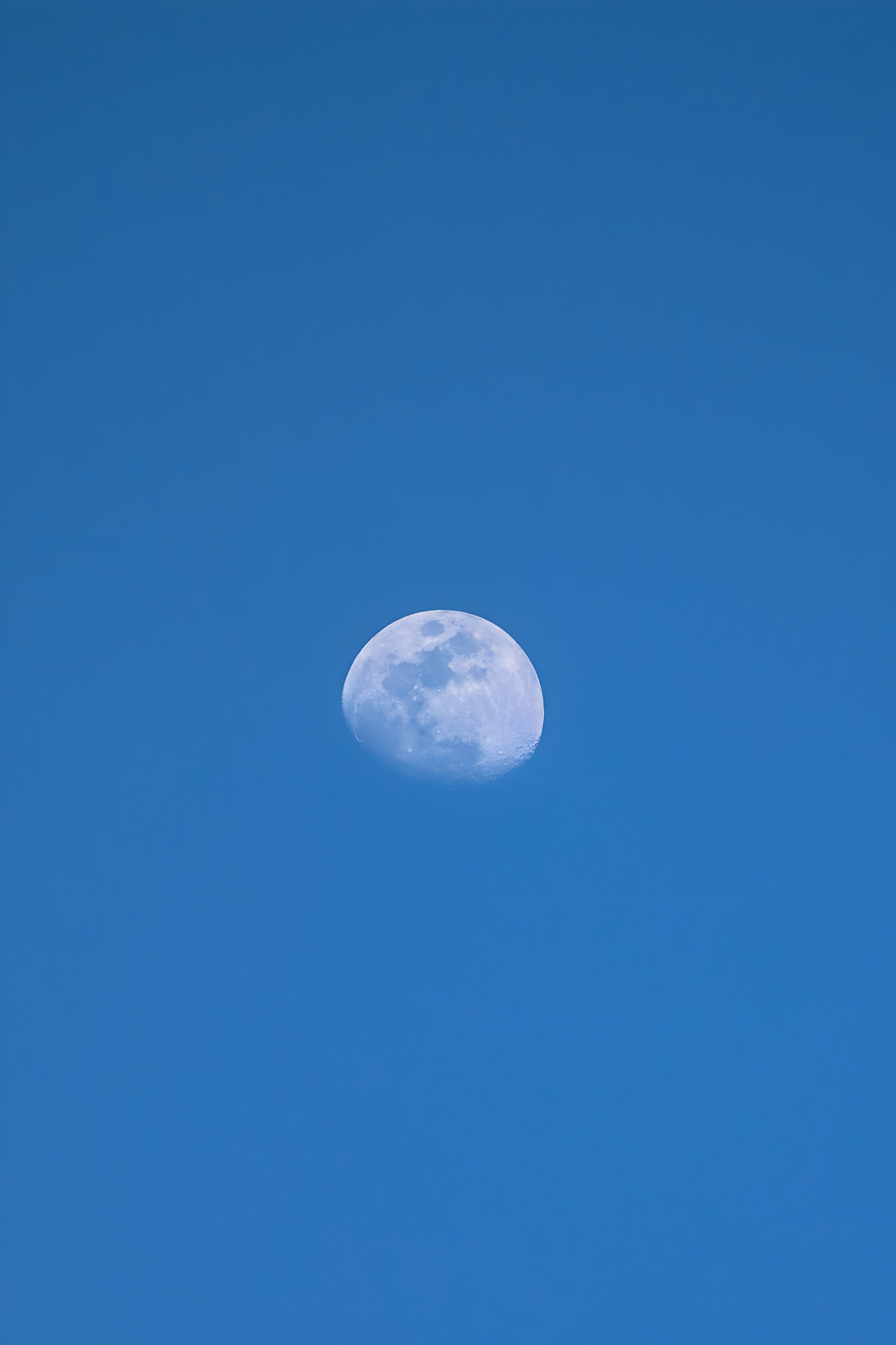 Bright Half Moon in Blue Daytime Sky · Free Stock Photo
