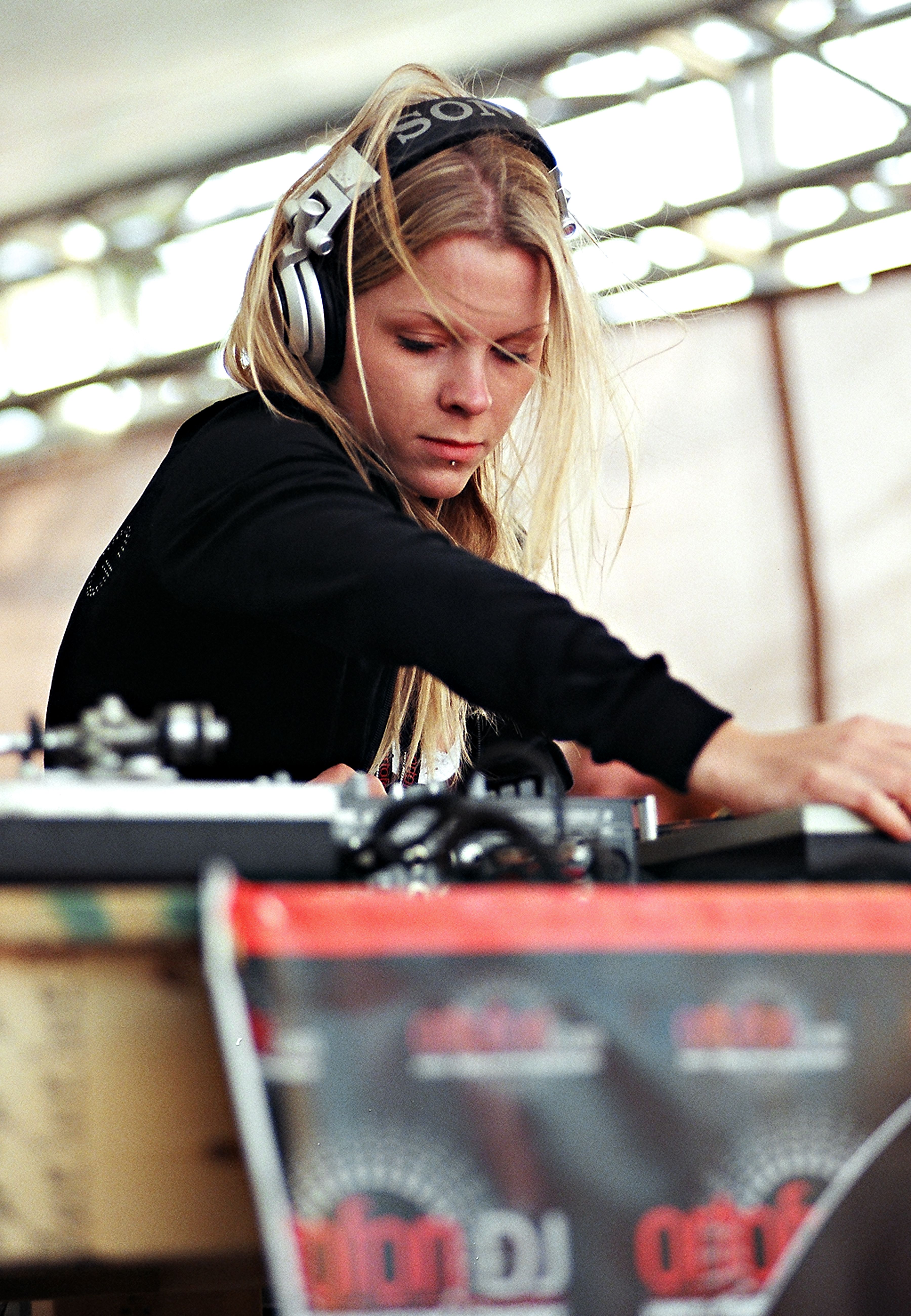 Energetic Female DJ Performing at Outdoor Event · Free Stock Photo