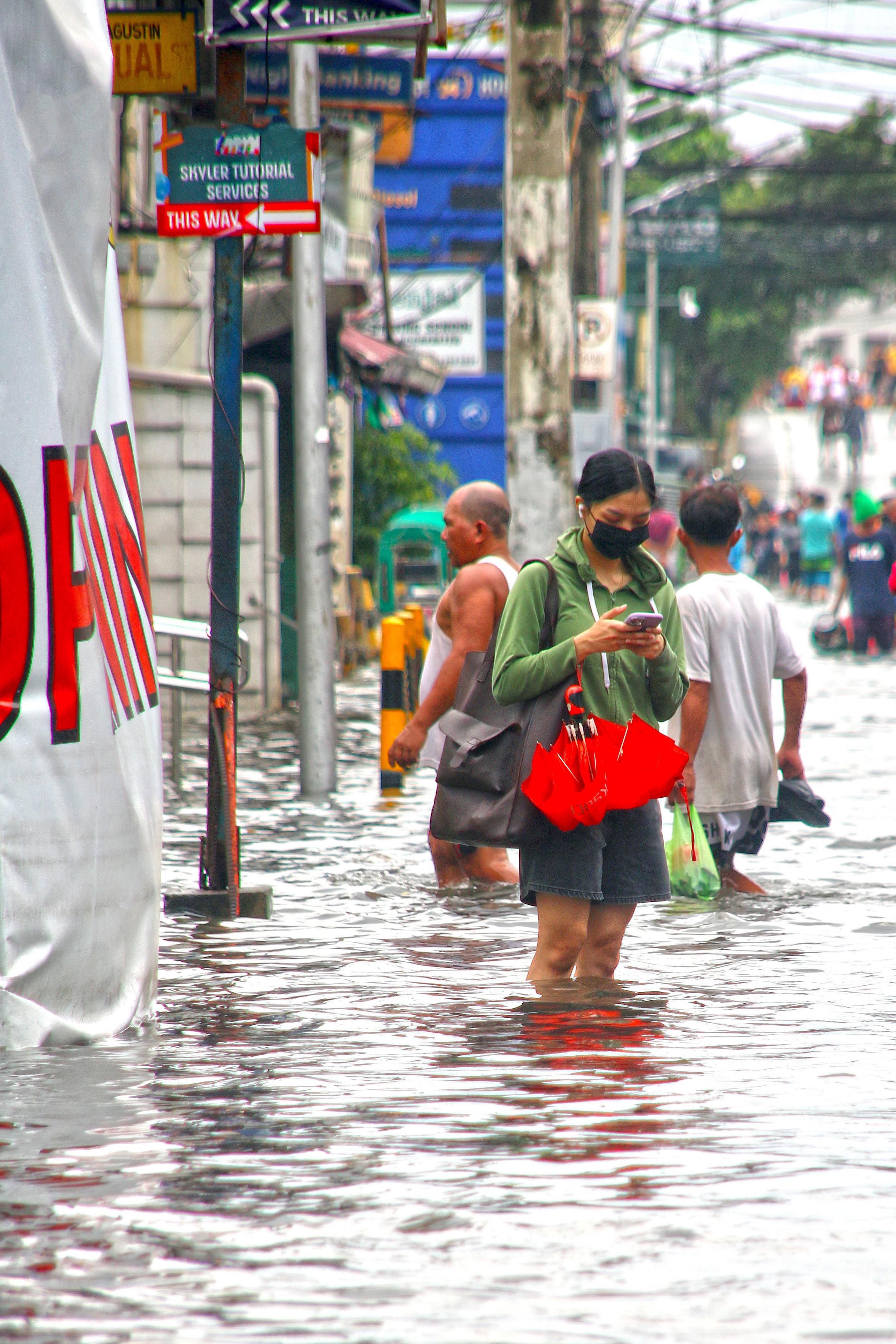 Flooded Street in Metro Manila with People Walking · Free Stock Photo
