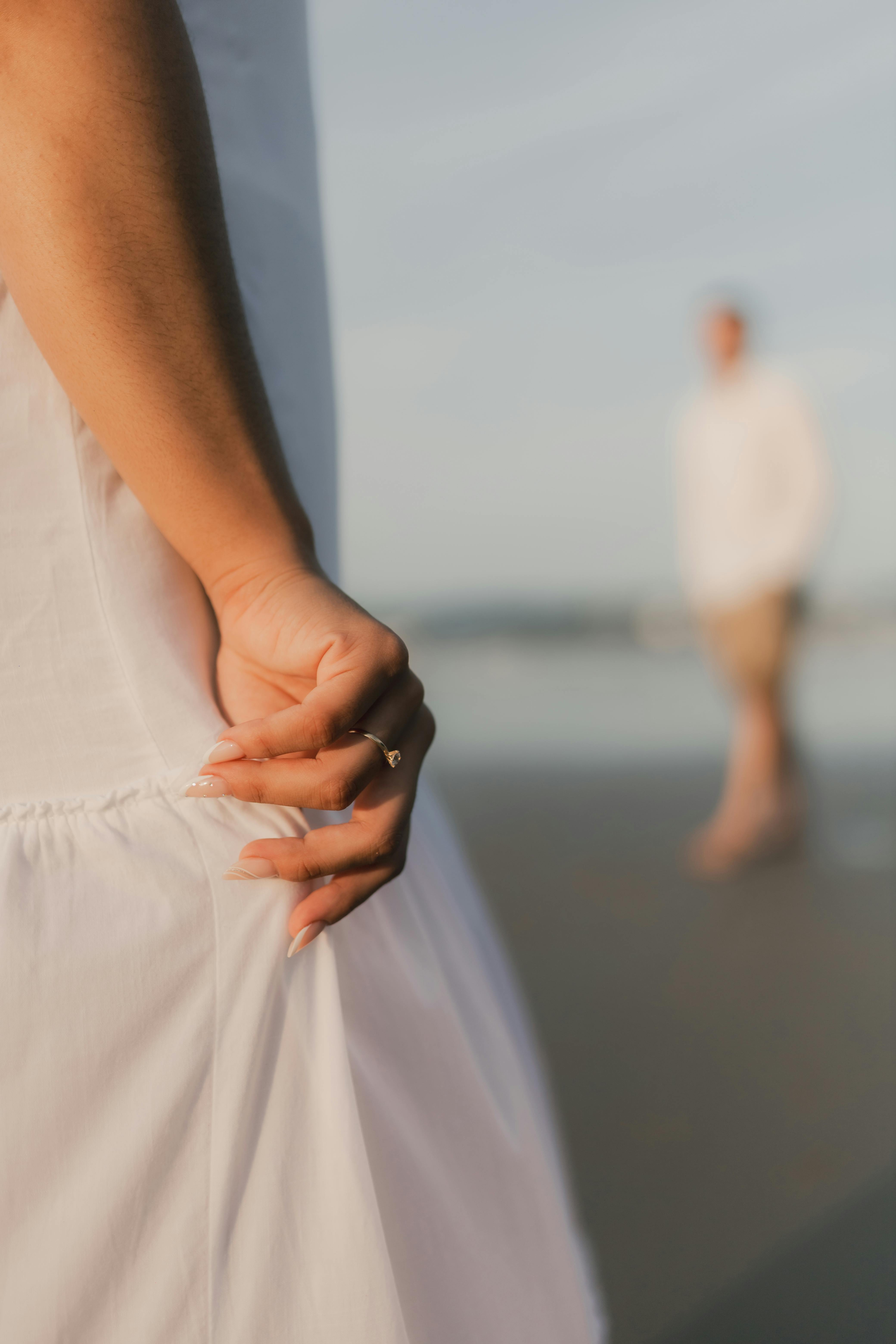 Romantic Beach Scene with Two People at Sunset · Free Stock Photo
