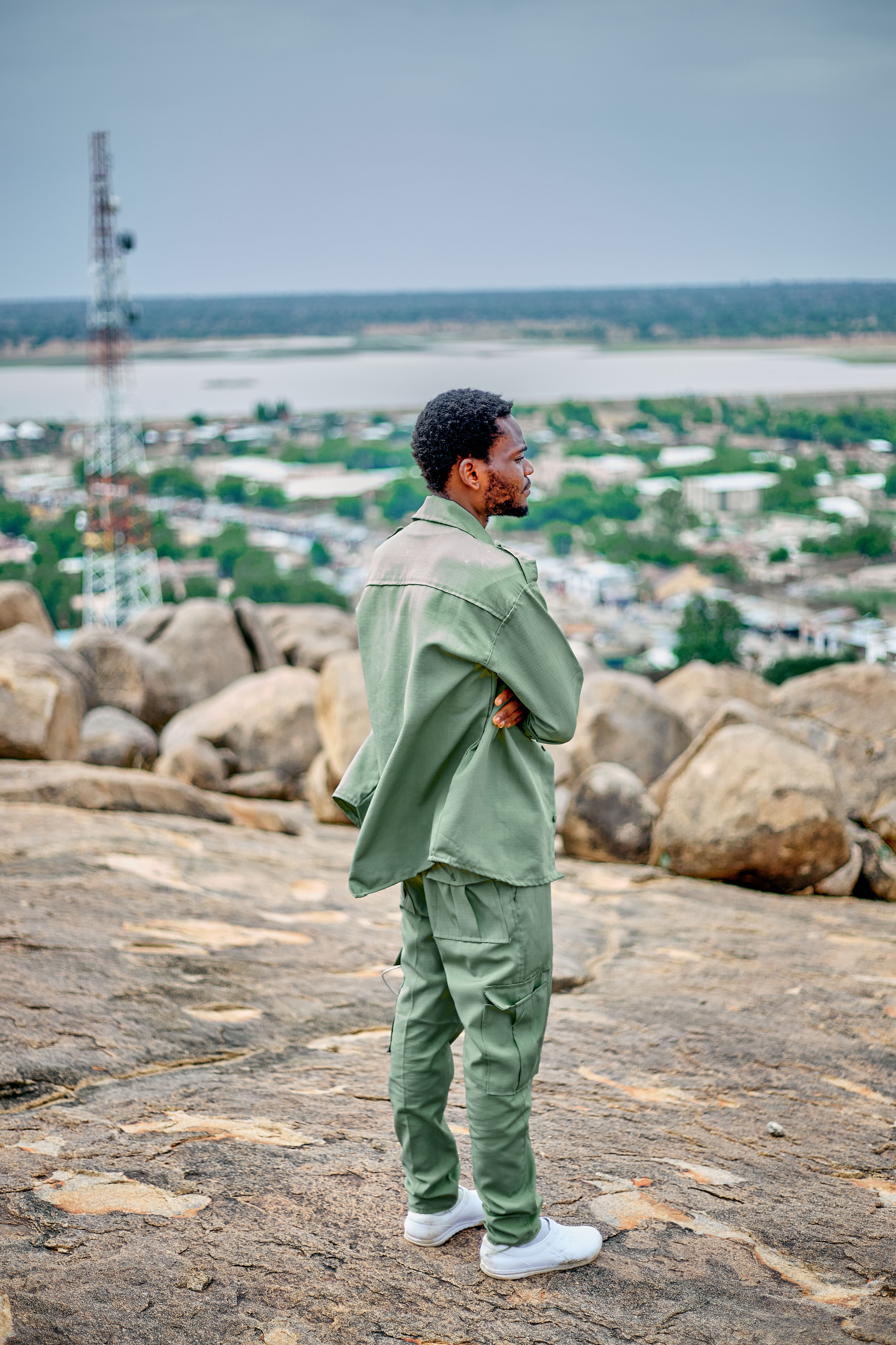 Man Overlooking Scenic Landscape with River · Free Stock Photo