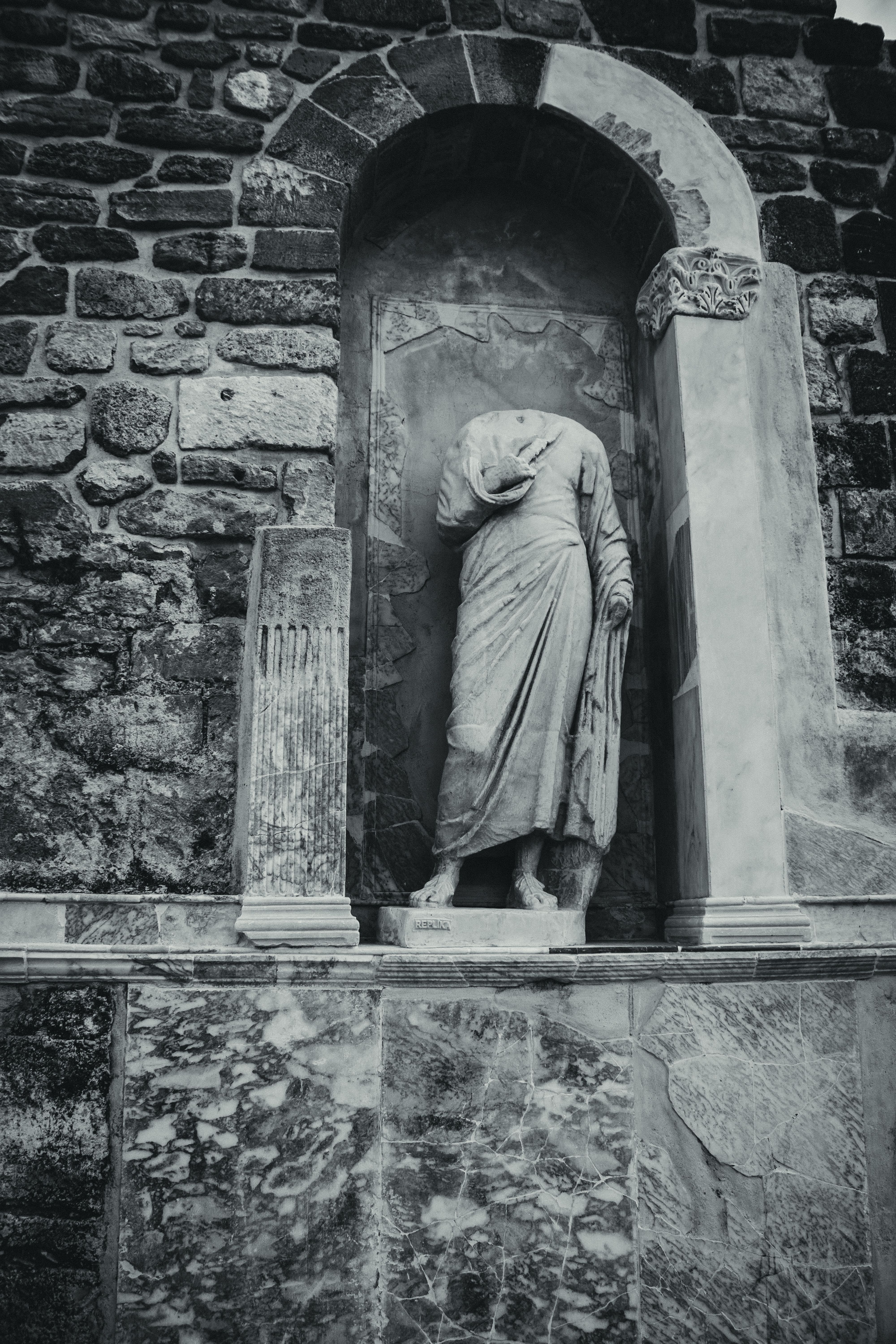 Ancient Headless Statue in Monochrome Setting · Free Stock Photo