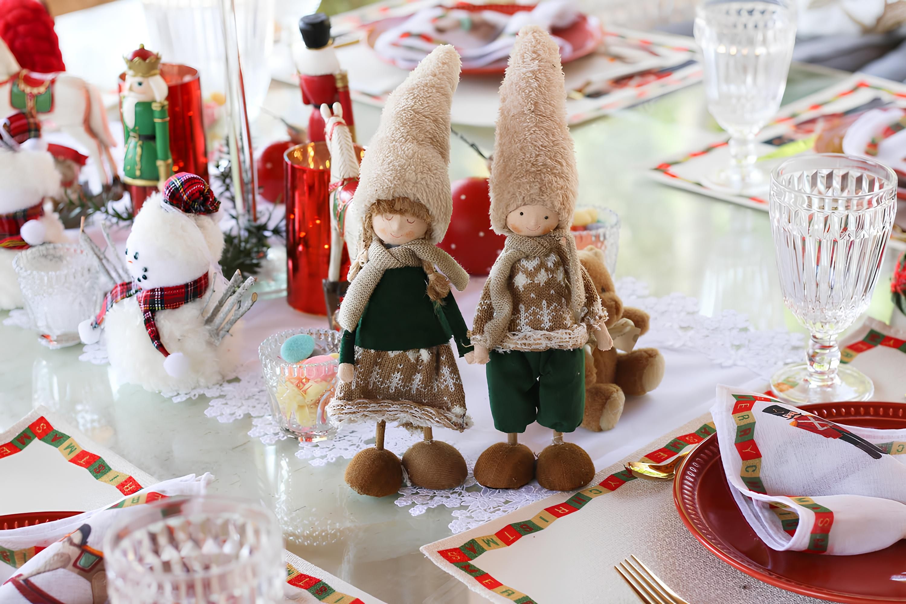 Charming Christmas Table Decor with Festive Figurines · Free Stock Photo