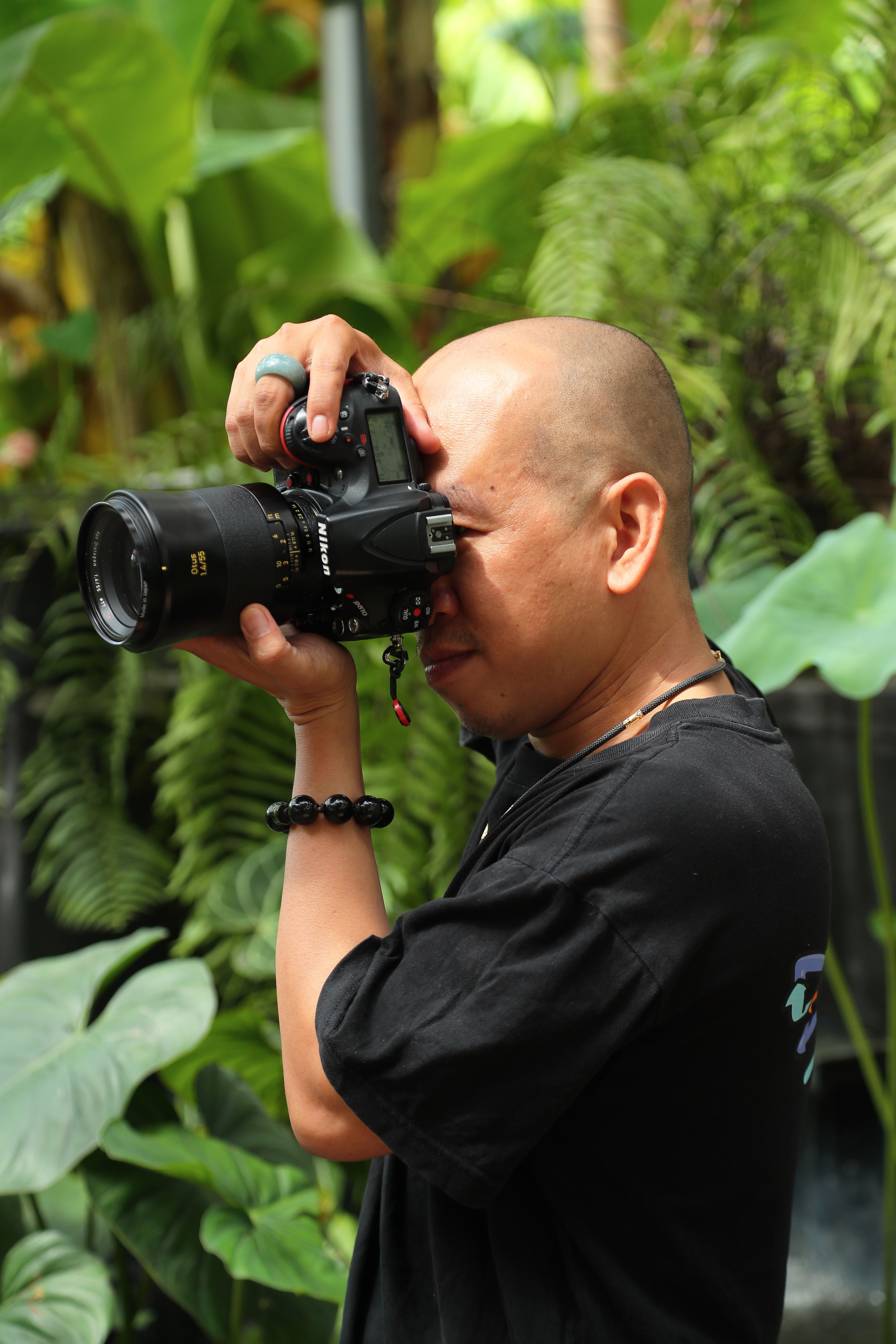 Photographer Capturing Nature Shots Outdoors · Free Stock Photo