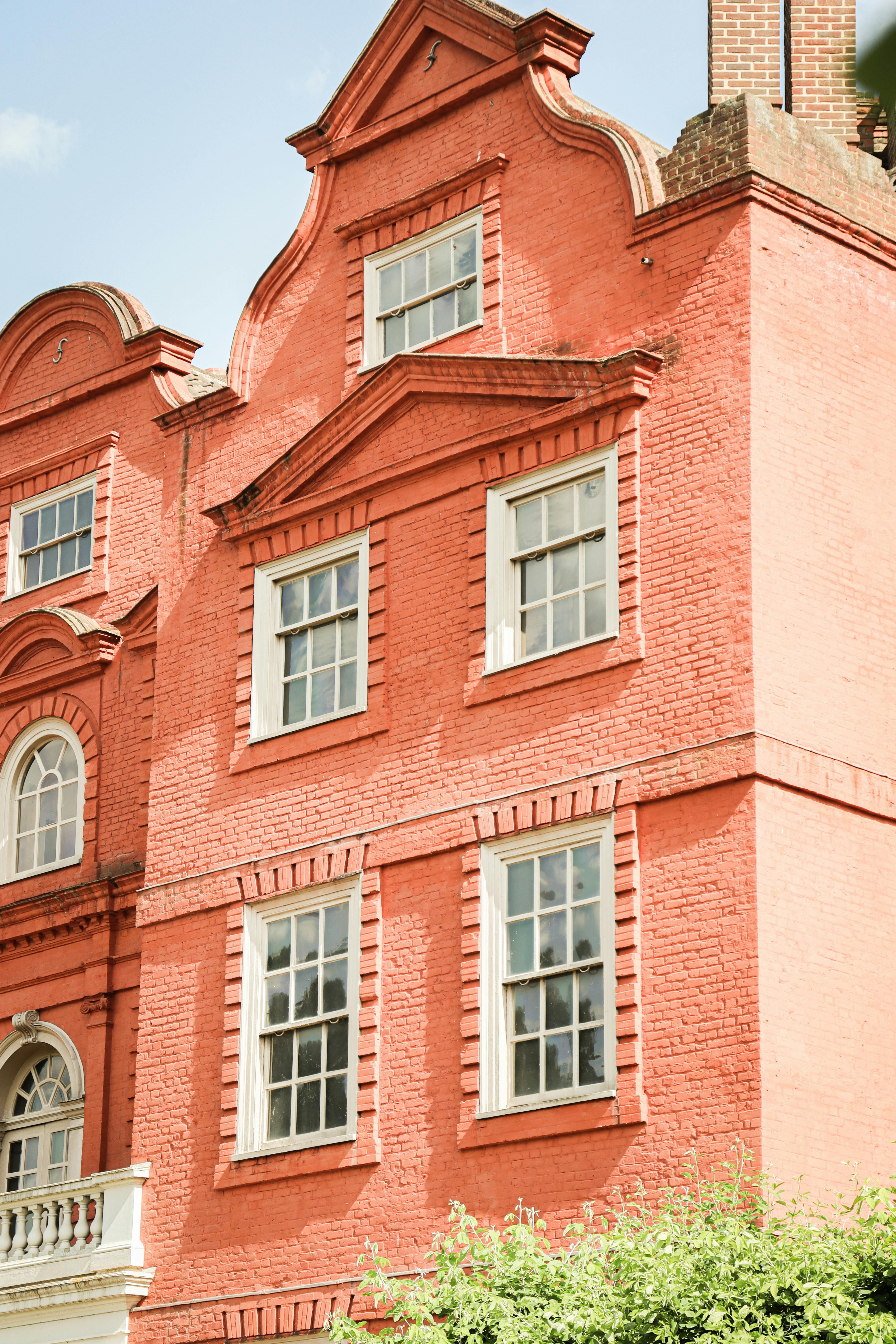 Historical Red Brick Building with Windows · Free Stock Photo