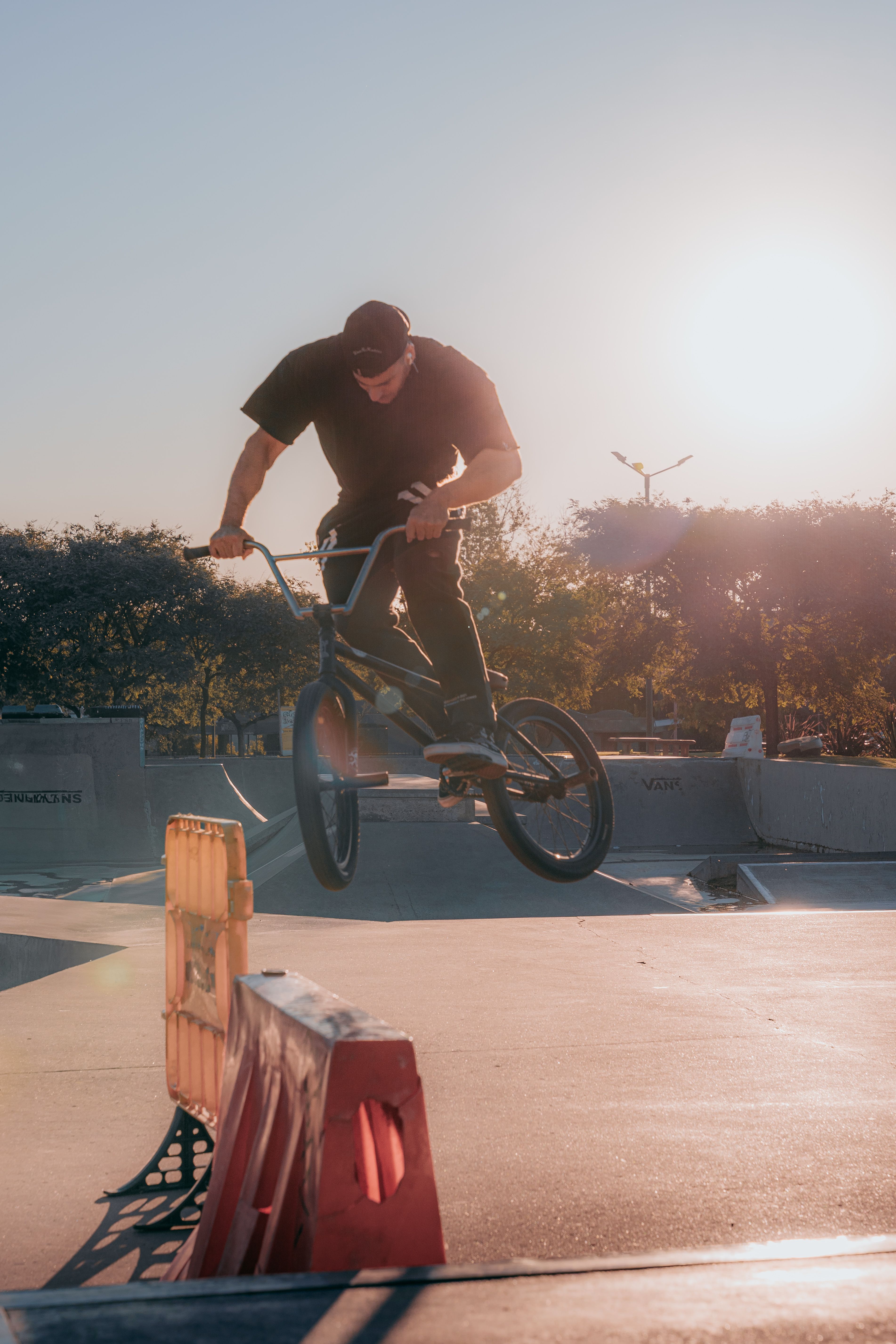Dynamic BMX Stunt at Skatepark during Sunset · Free Stock Photo