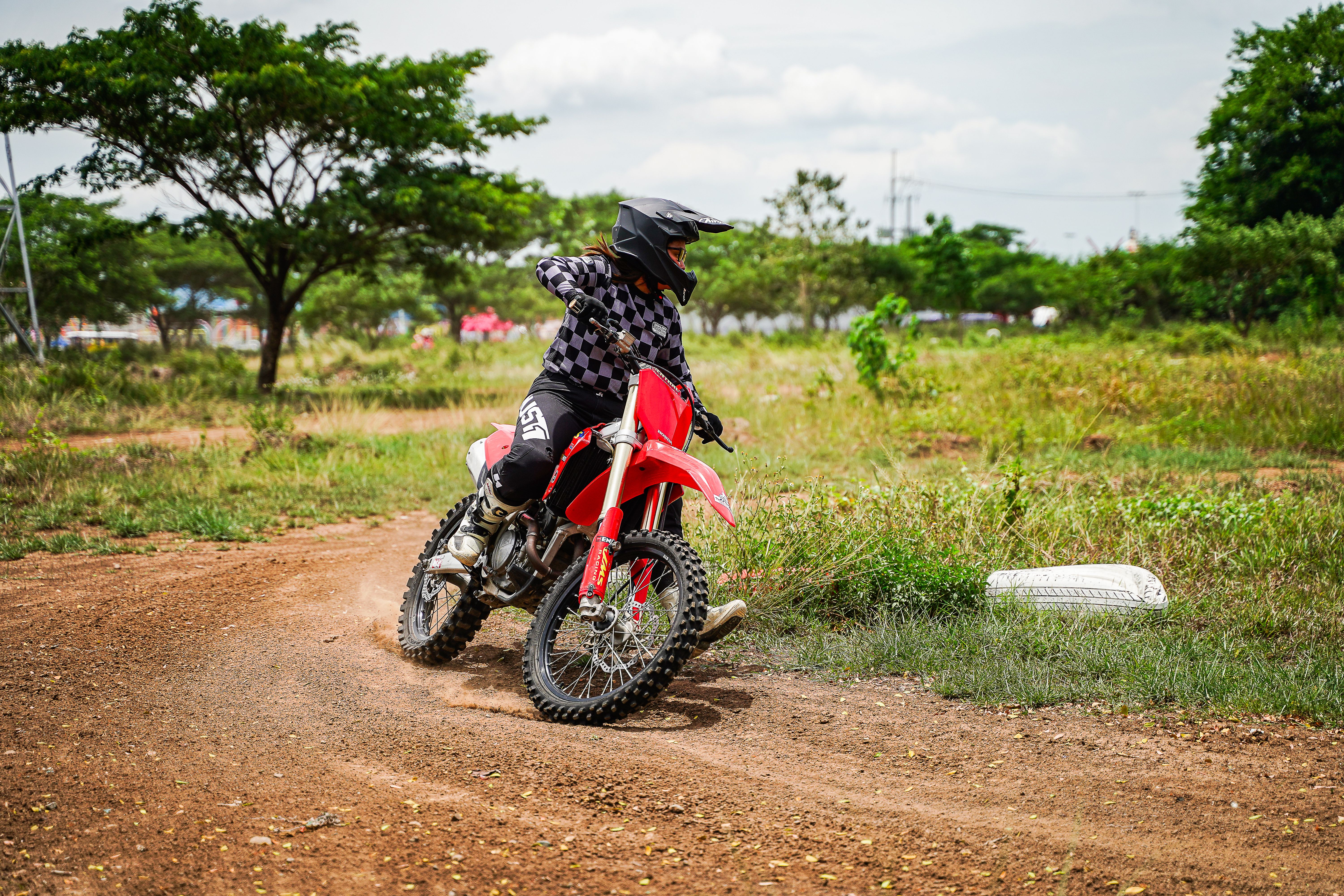 Motocross Rider Turning on Dirt Track Outdoors · Free Stock Photo