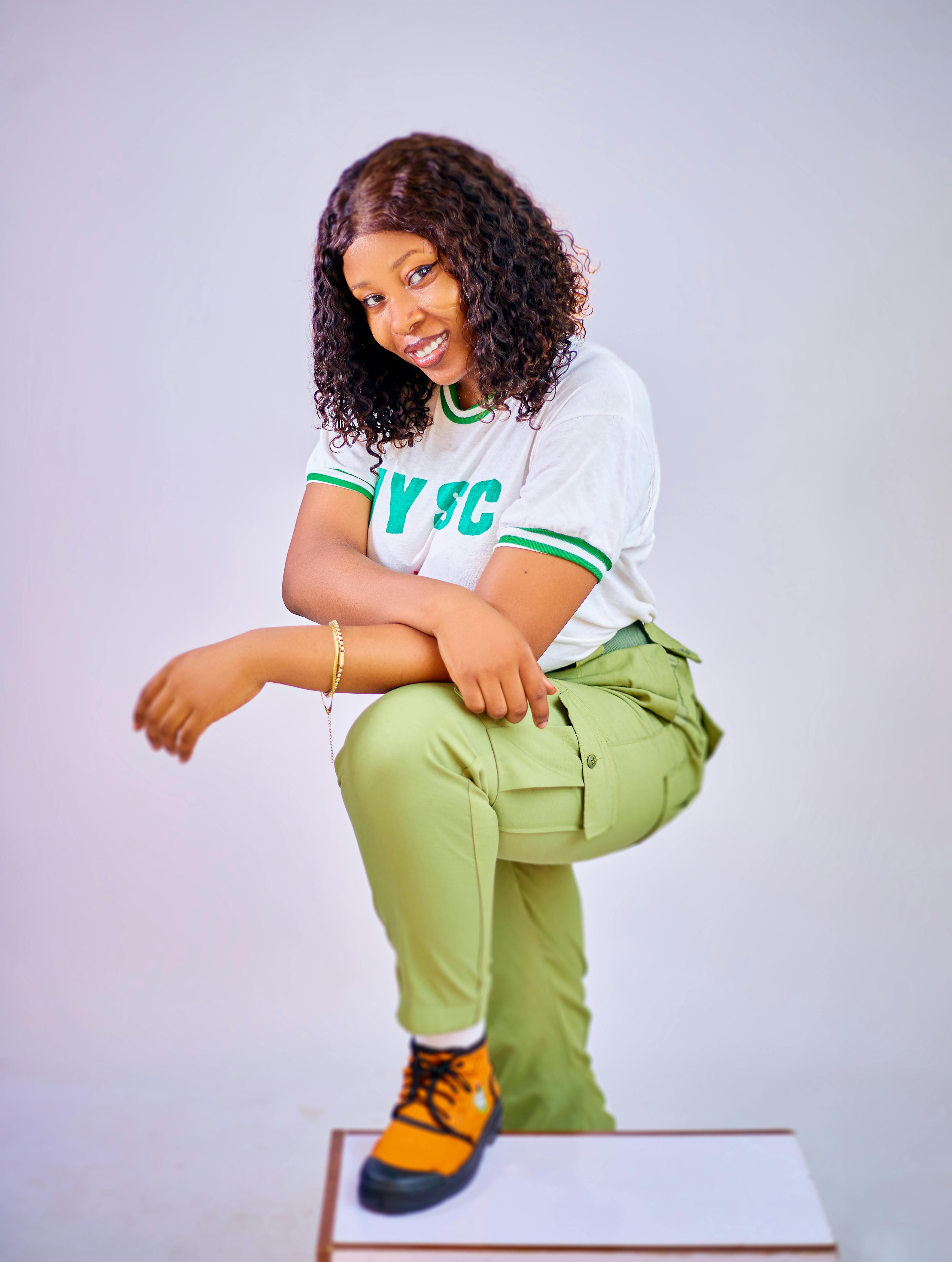 Young Woman in NYSC Uniform Posing Confidently · Free Stock Photo