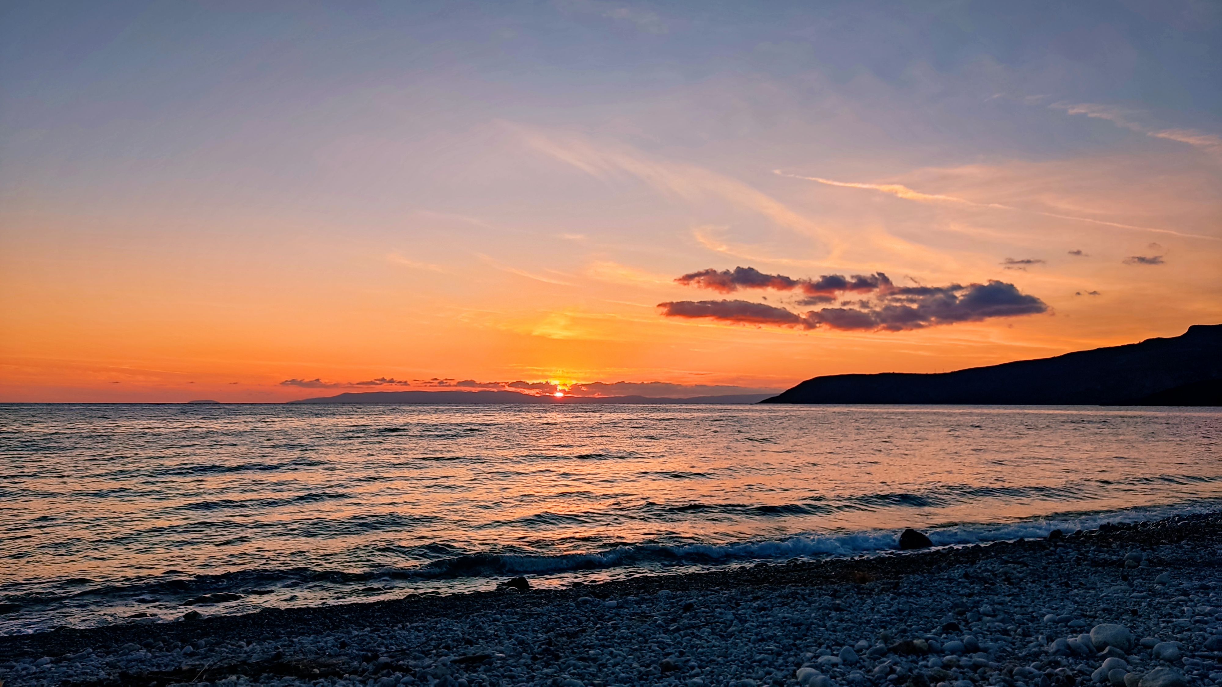 Sunset over Rocky Shoreline in Greece · Free Stock Photo