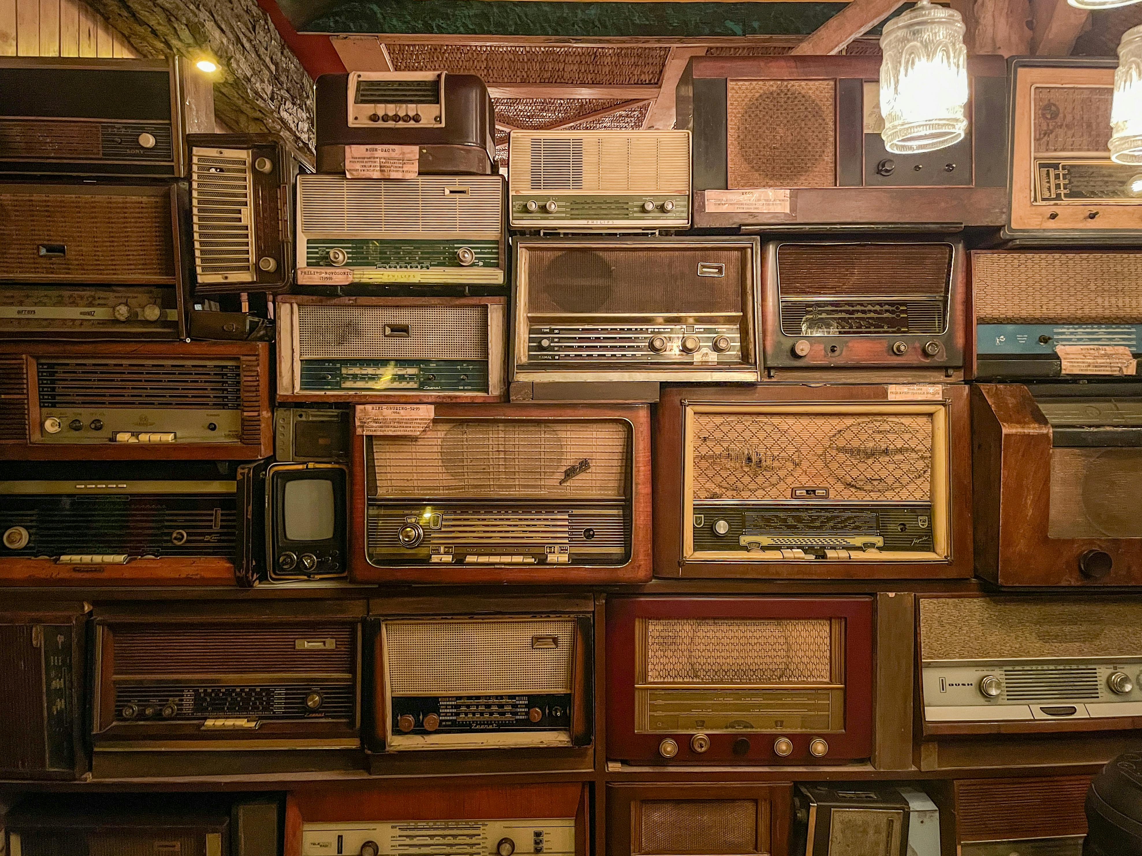 Stack of Vintage Radios and Televisions Indoors · Free Stock Photo