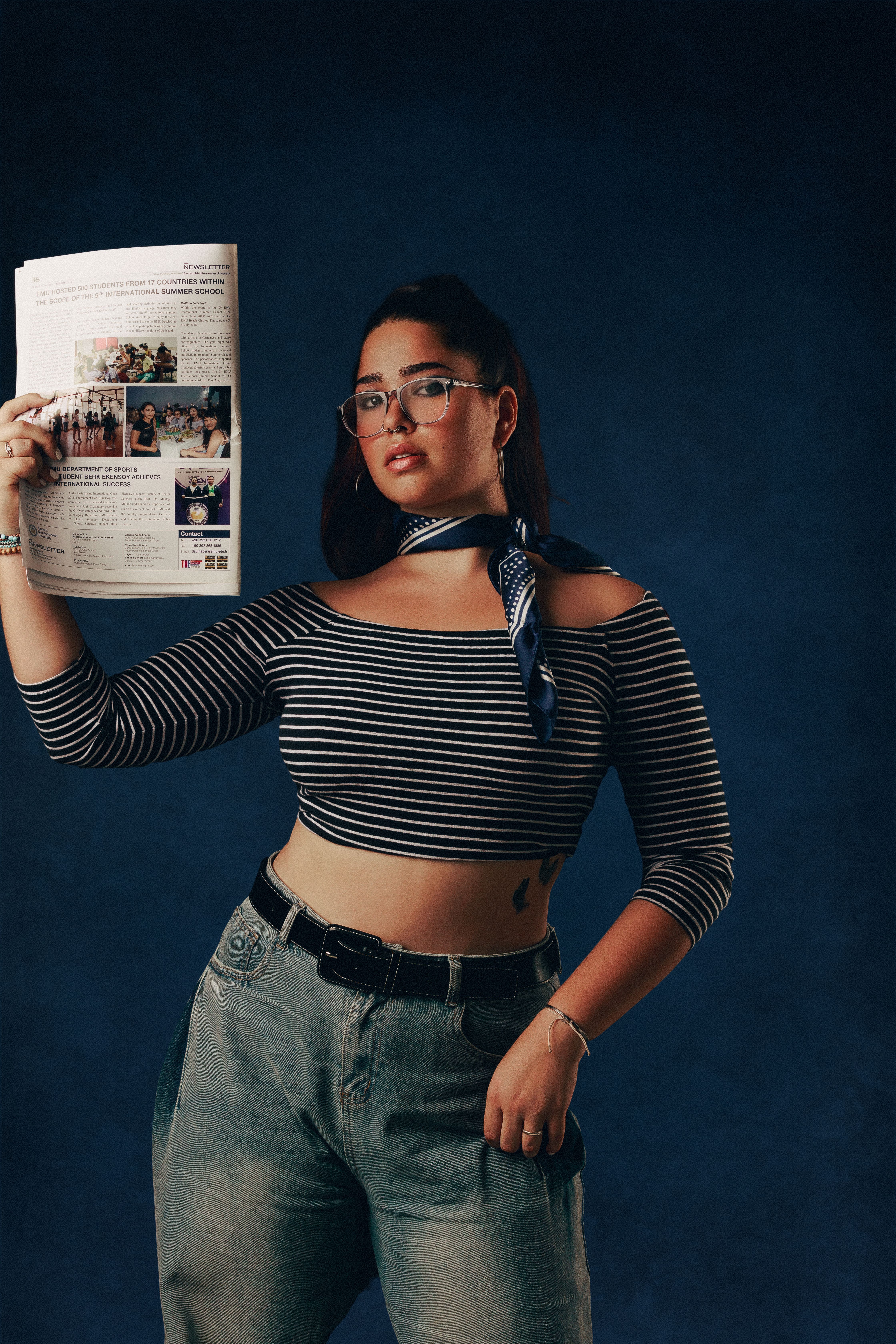 Confident Woman Holding Magazine in Stylish Portrait · Free Stock Photo