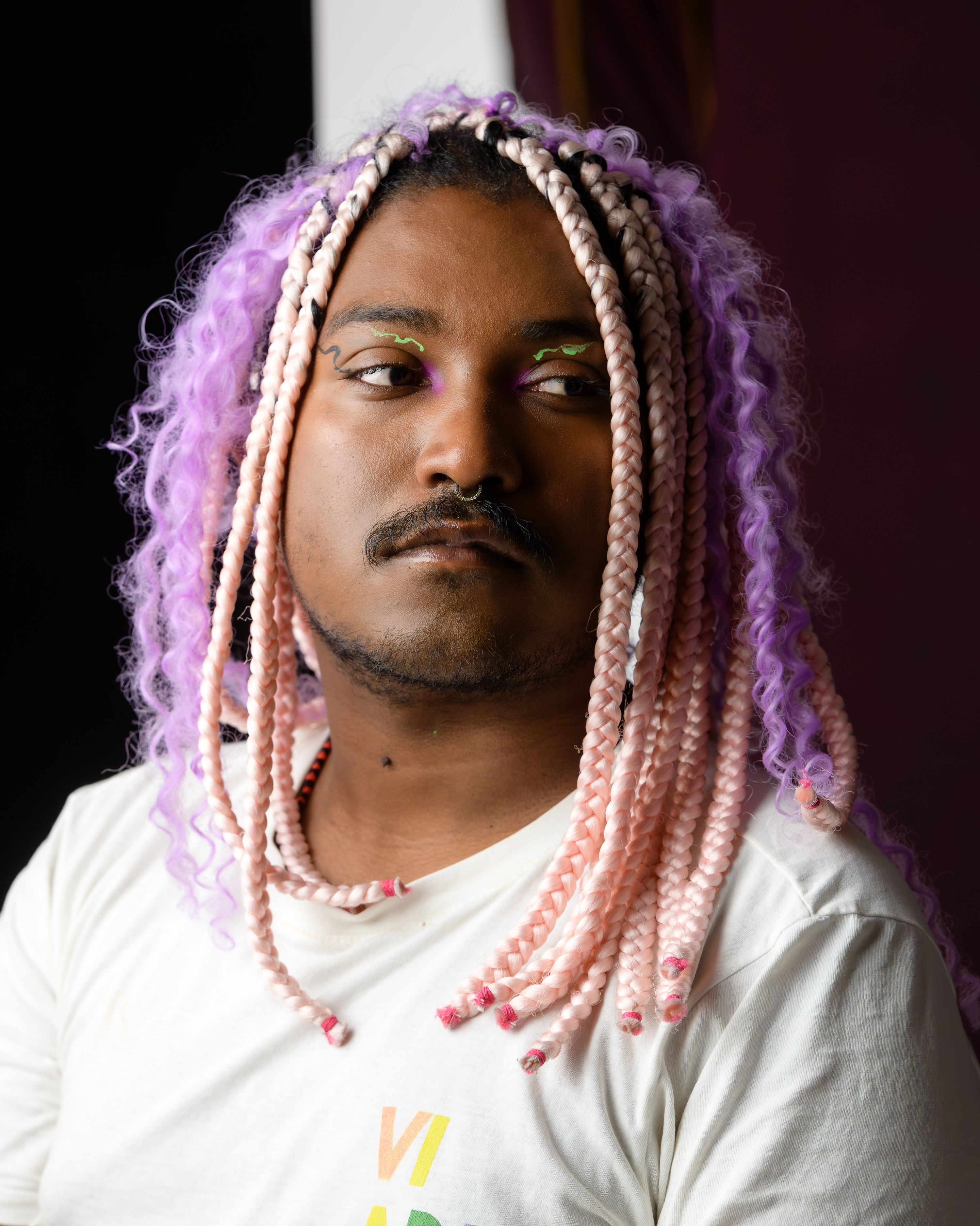 Young Man with Mustache Wearing Pink Artificial Braids · Free Stock Photo