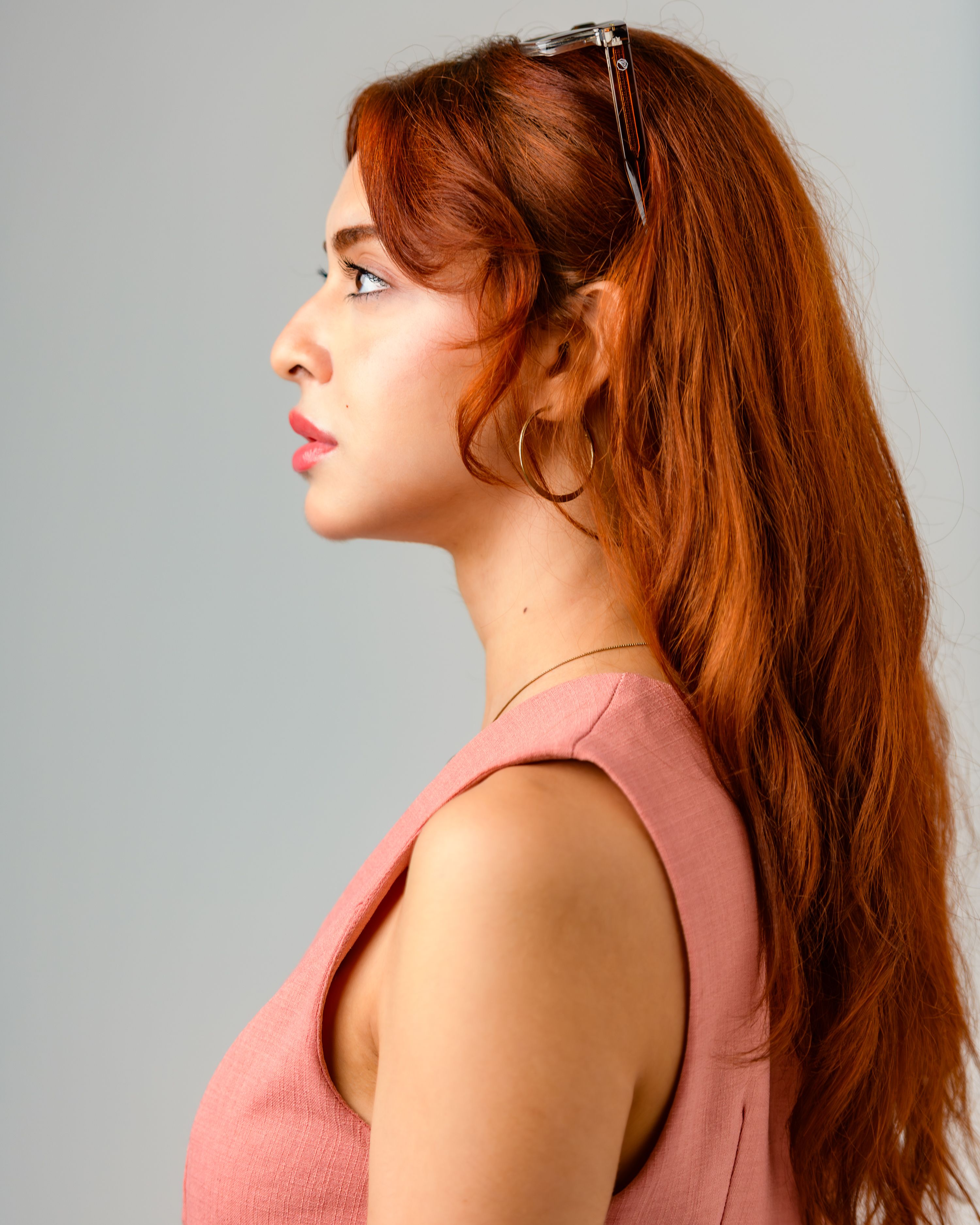 Profile Portrait of a Red-Haired Woman in Pink Top · Free Stock Photo