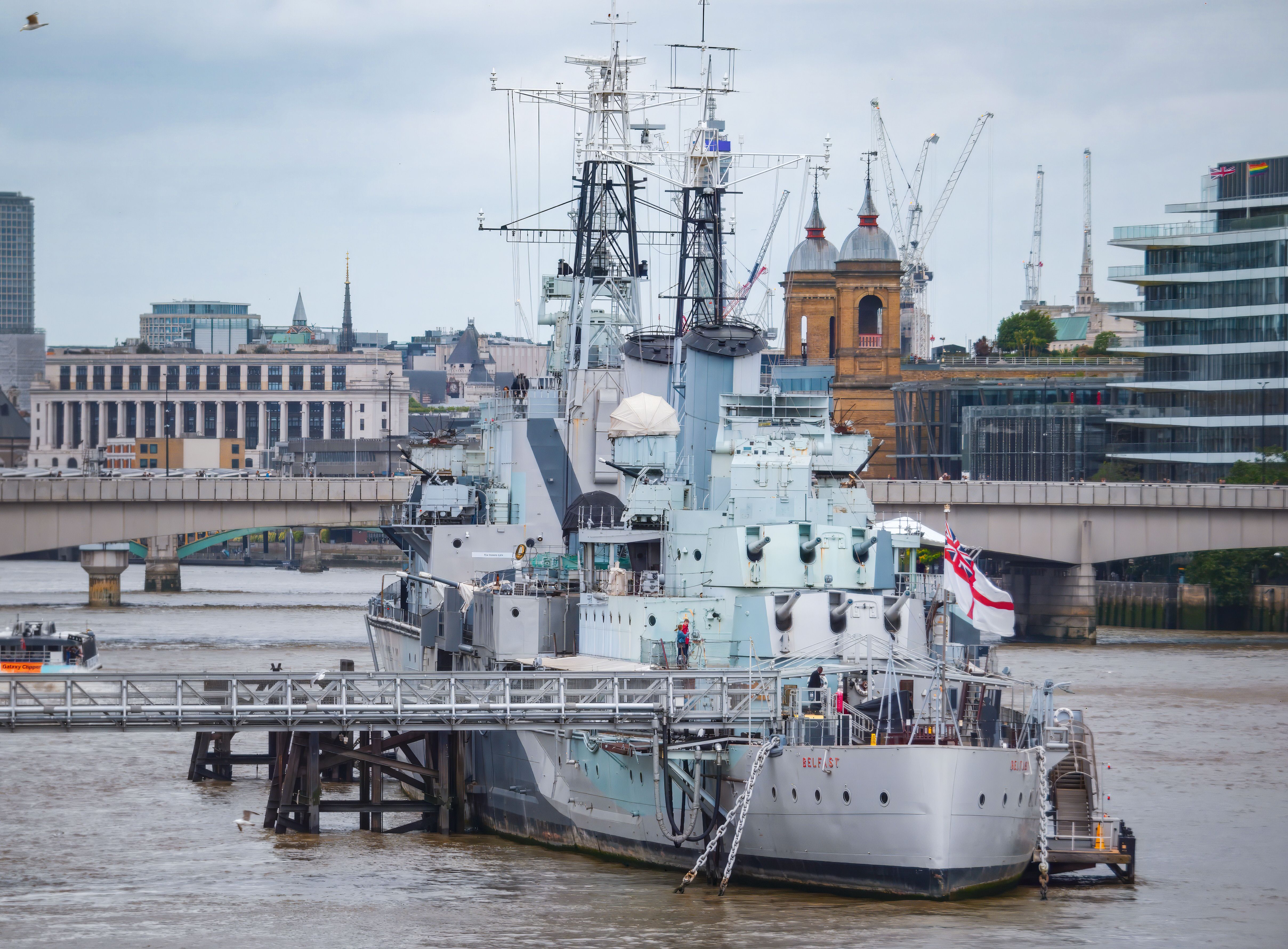 Historic Navy Ship on Thames with London Skyline · Free Stock Photo