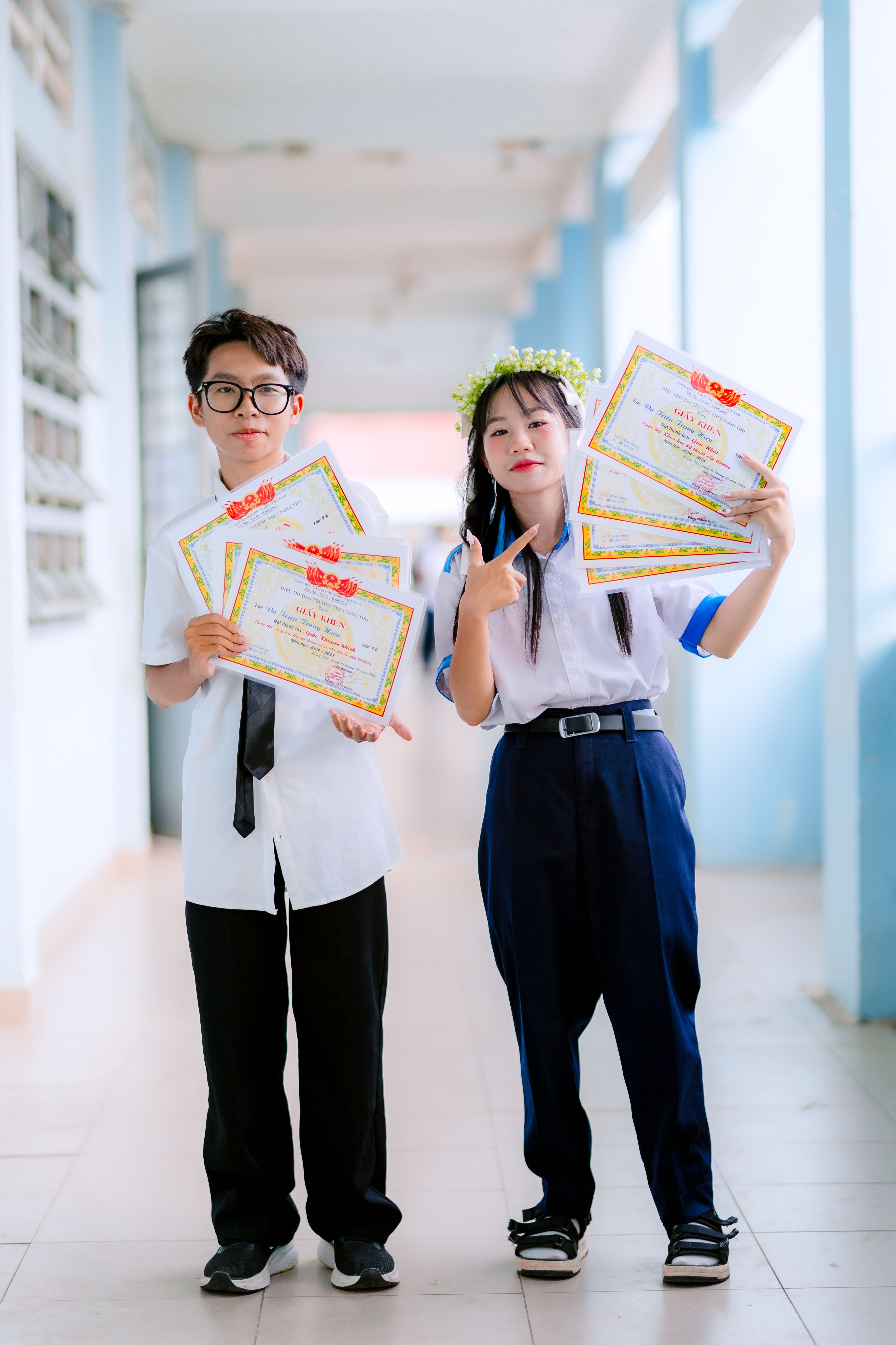 Students Celebrating Achievements in School Hallway · Free Stock Photo