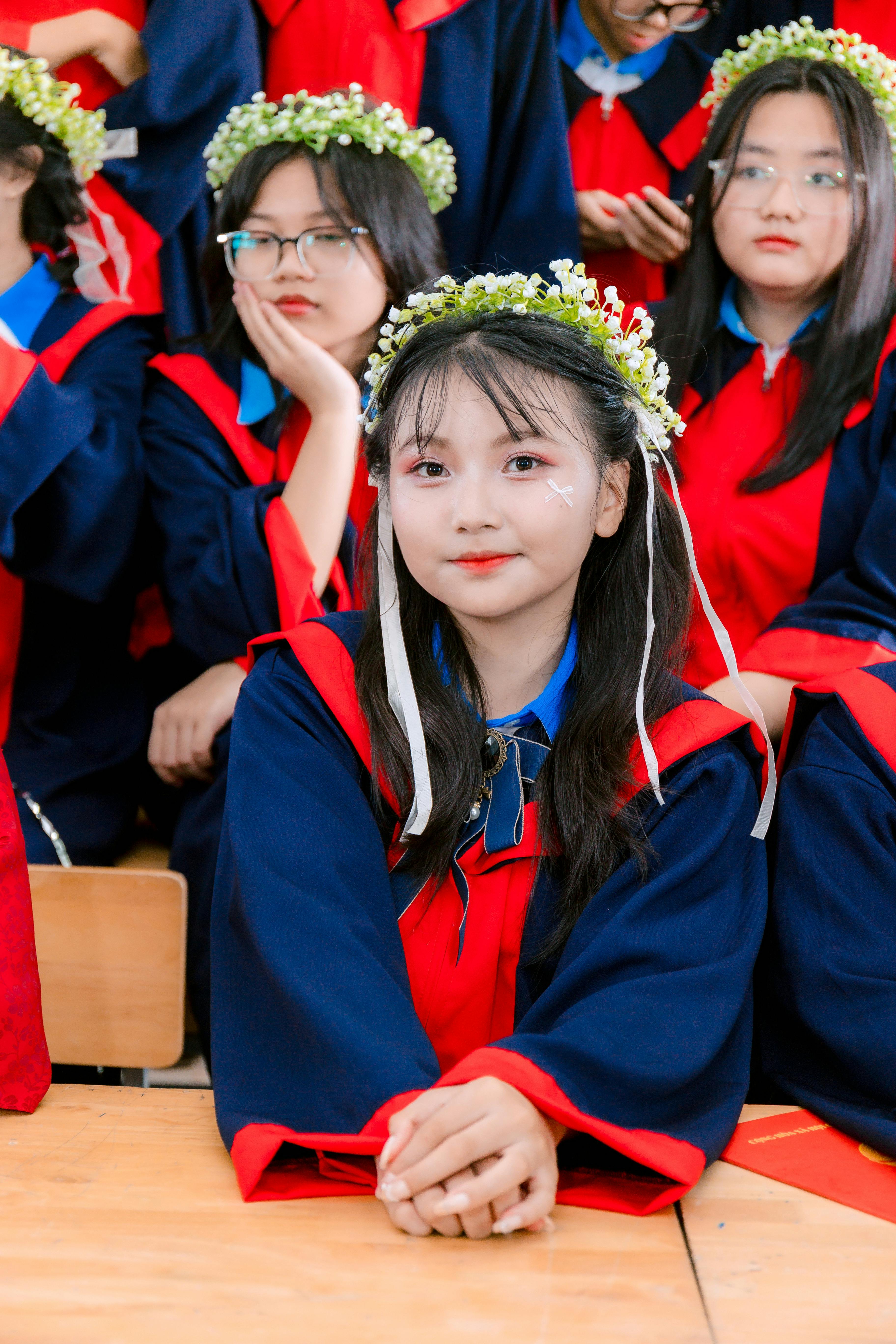 Graduation Ceremony with Students in Red Robes · Free Stock Photo